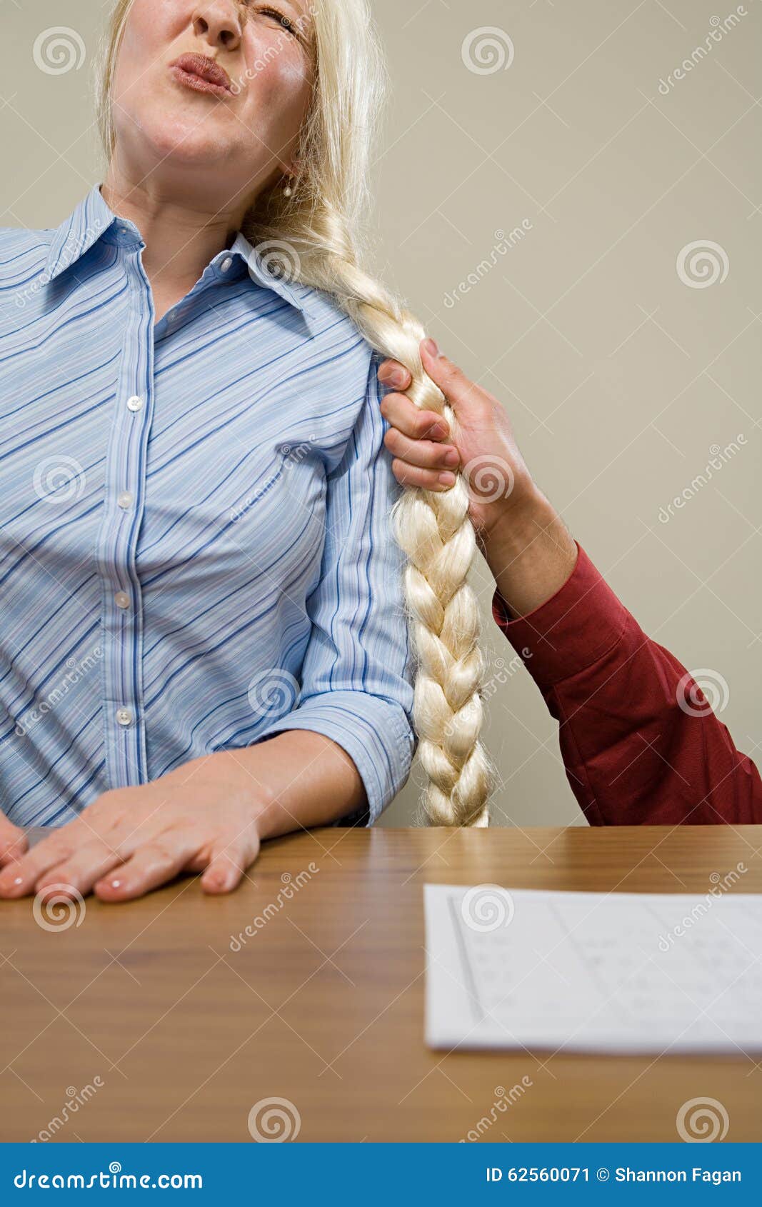 Man pulling colleagues wig stock image. Image of human - 62560071