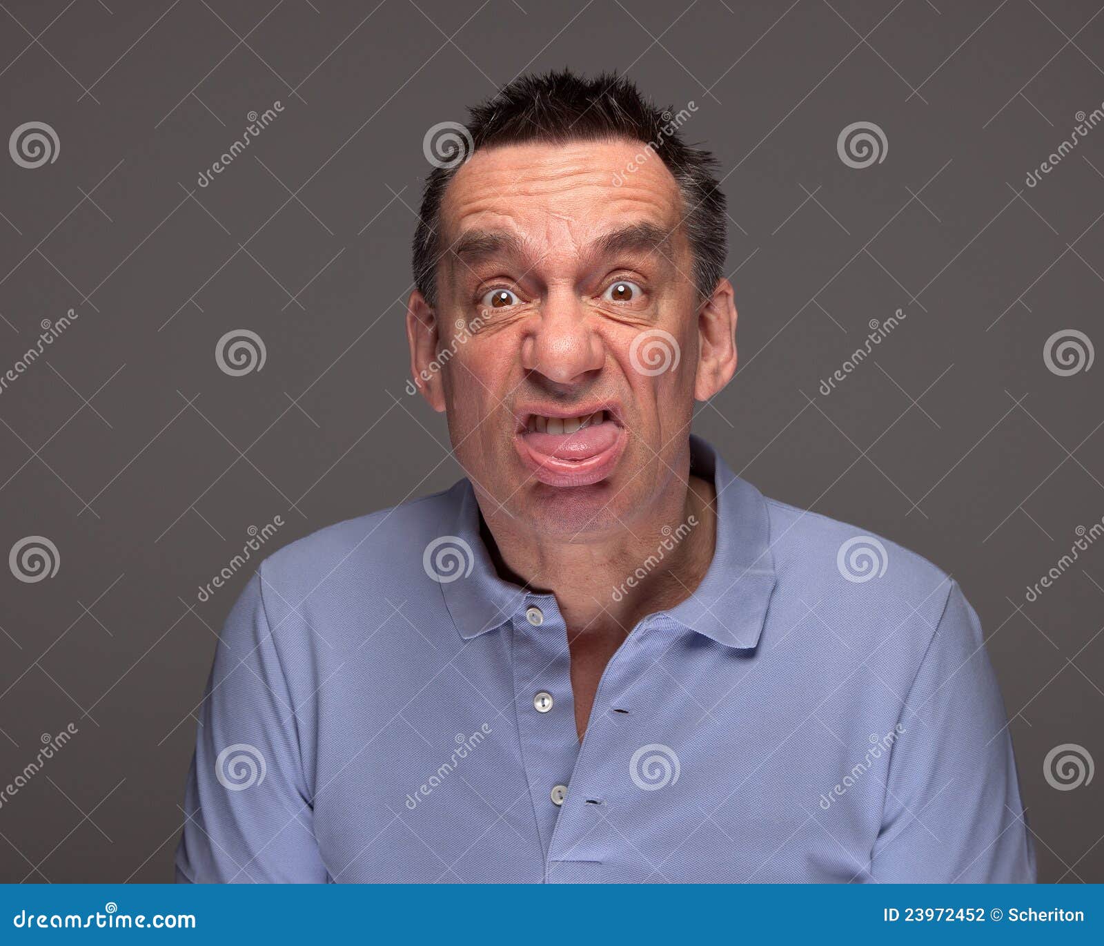 Man Pulling Face Sticking Out Tongue Stock Photo - Image of staring ...
