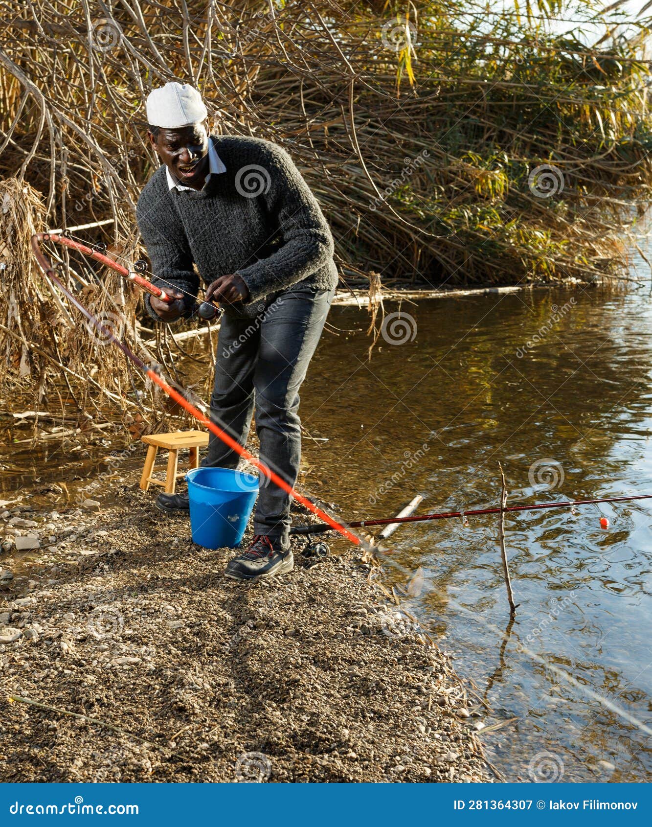 Man and Pulling Fish Near River Stock Image - Image of fish, coast ...