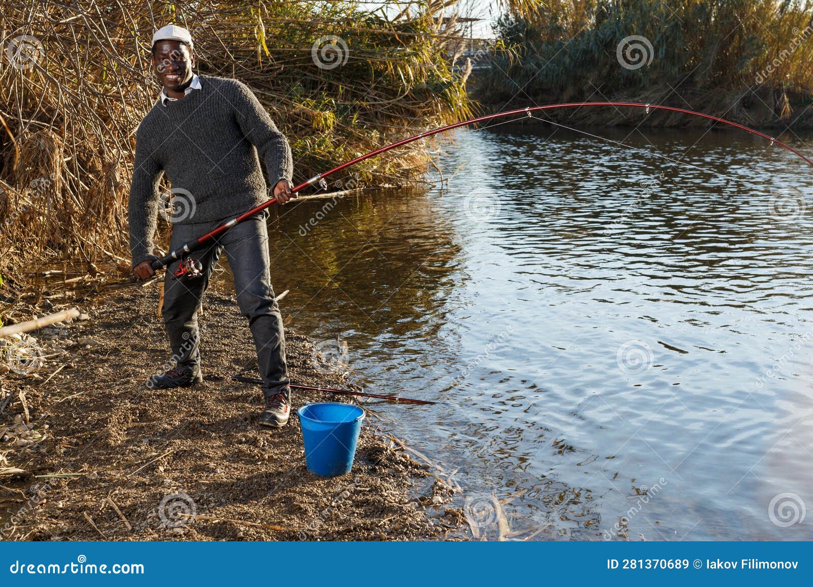 Man and Pulling Fish Near River Stock Image - Image of catch, fresh ...