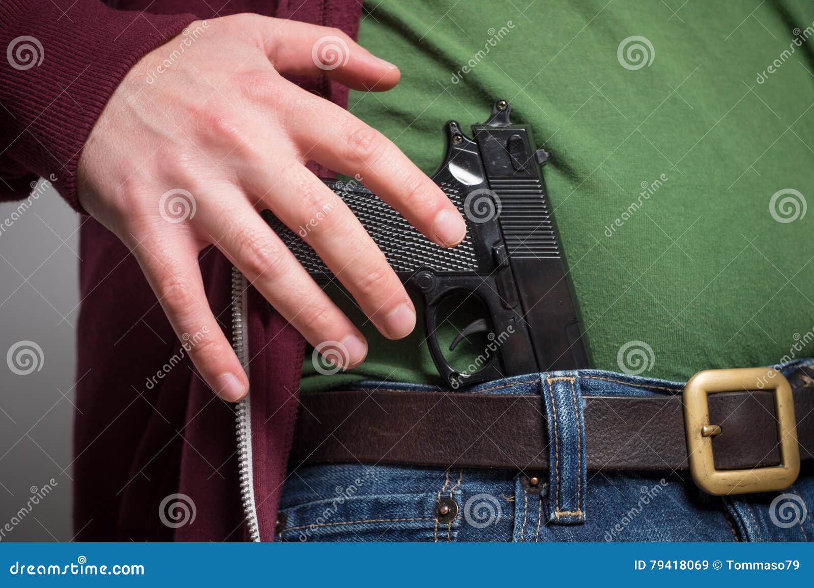 Man Pulling Out a Gun Ready To Shoot Stock Image - Image of firearm ...