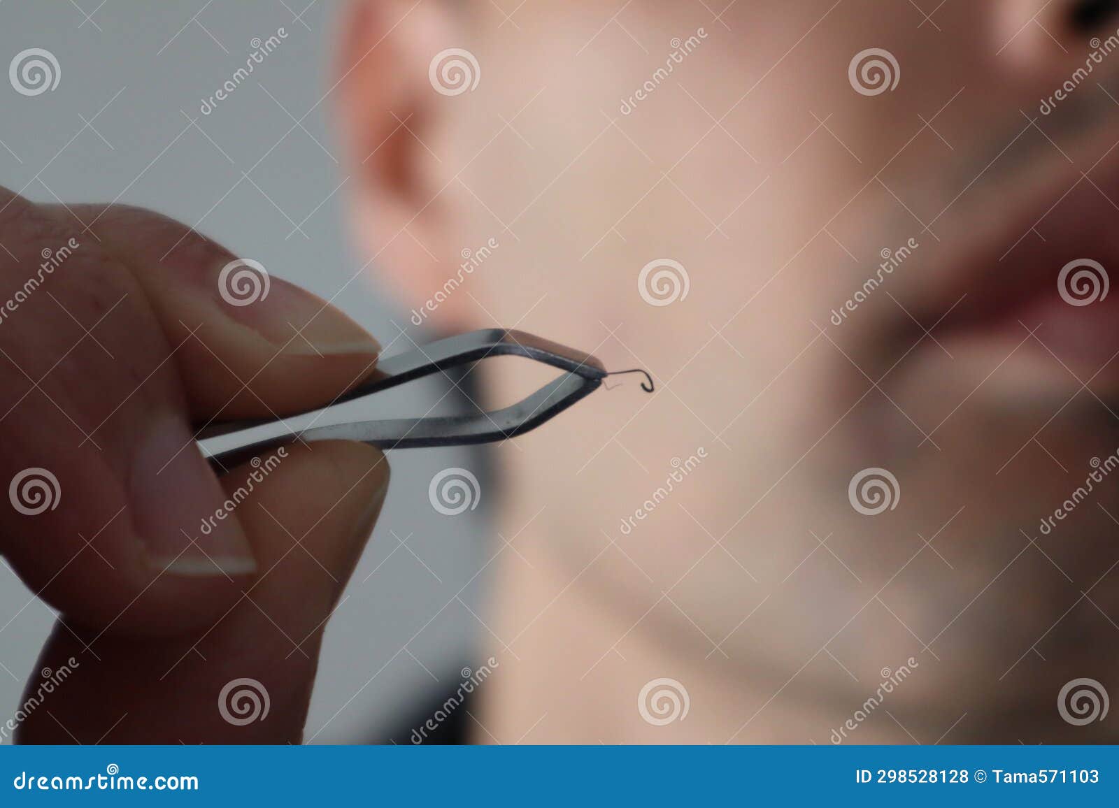 A Man Pulling Out His Beard with Tweezers Stock Photo - Image of ...