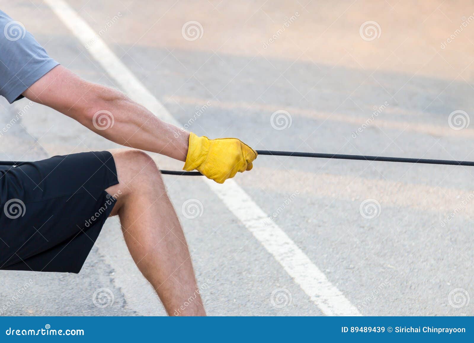 Man Pulling the Rope with Yellow Glove Stock Image - Image of ...