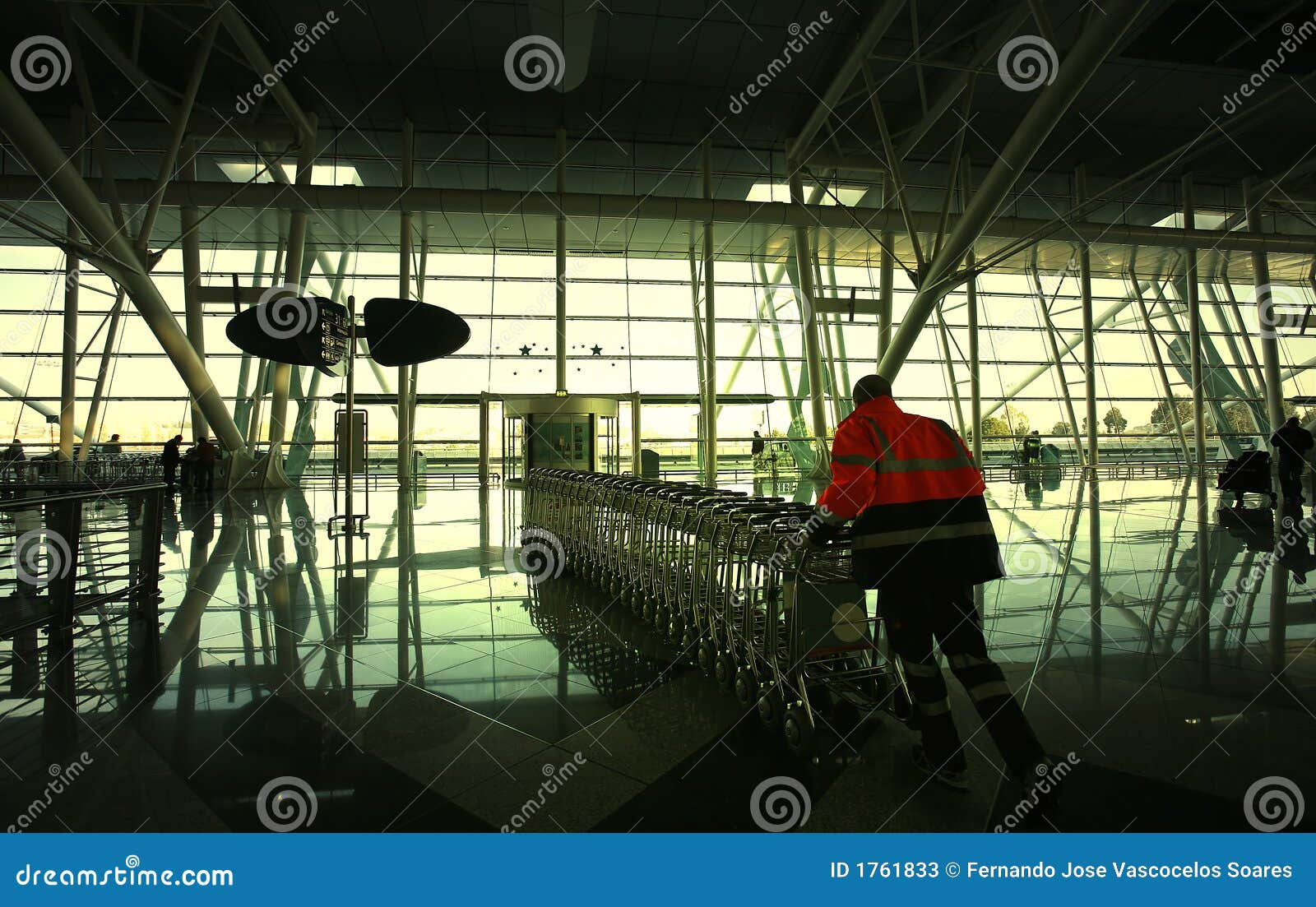 Man pulling trolleys stock image. Image of luggage, plain - 1761833