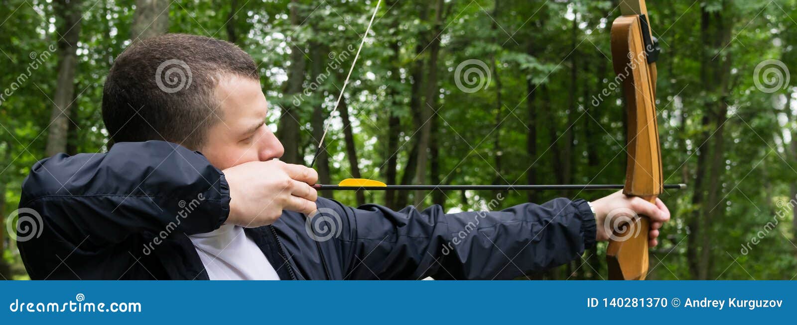 Man Pulls a Bow String for a Shot in the Forest, Close-up, Long Photo ...
