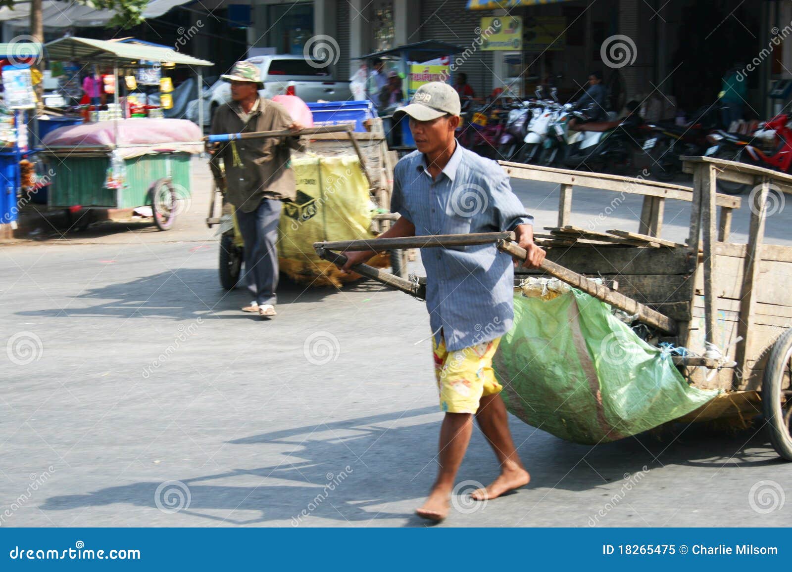 Man Pulls a Cart Along the Road, Thailand. Editorial Image - Image of ...