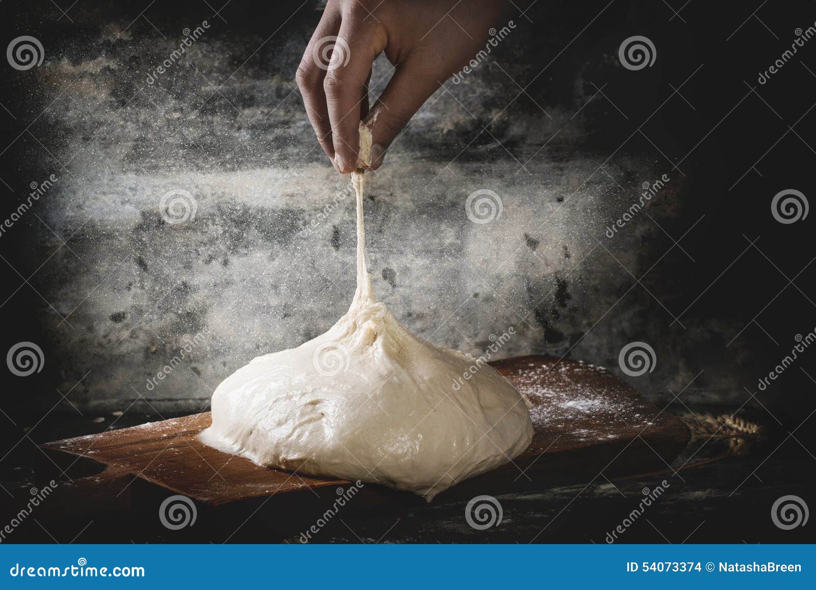 Man pulls the dough stock photo. Image of preparation - 54073374