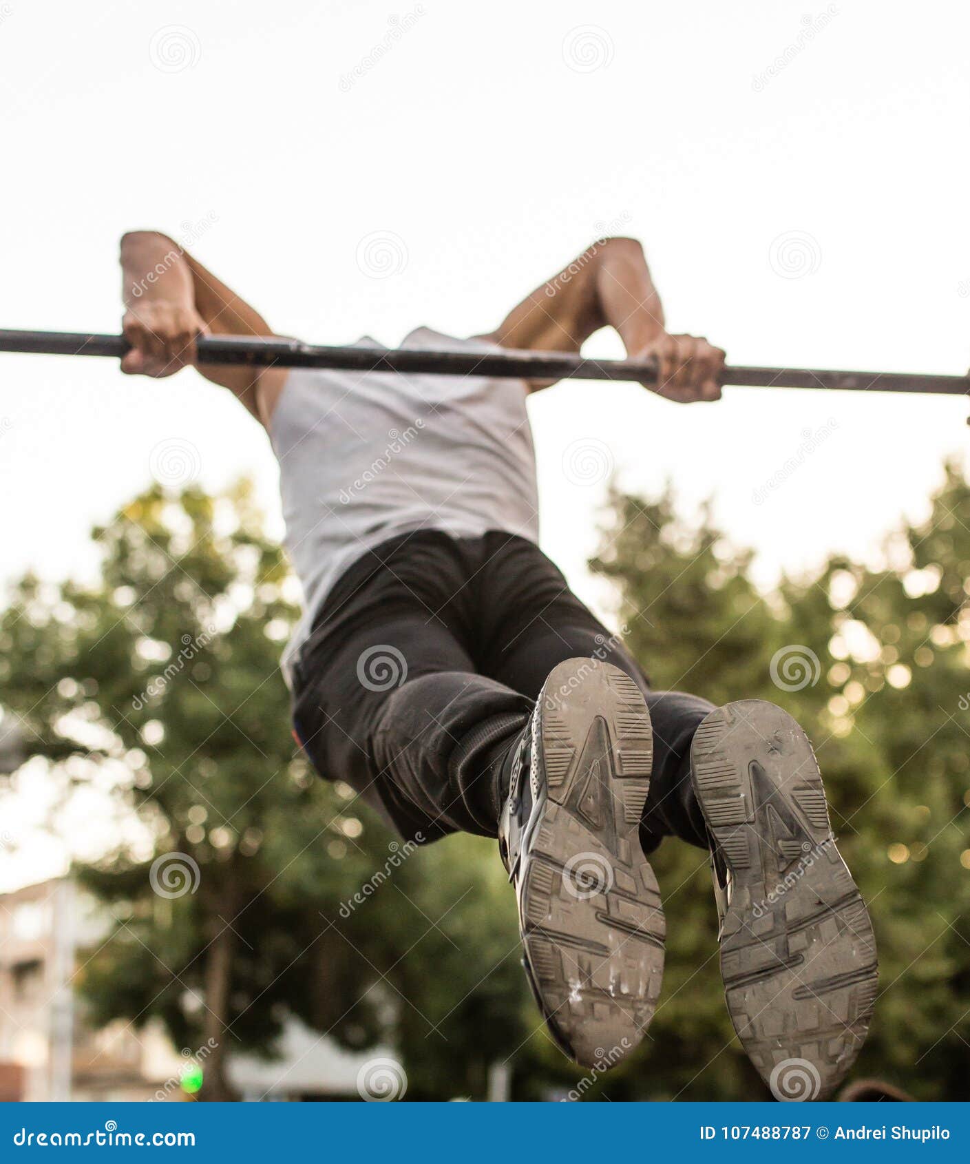 The Man Pulls Himself Up on the Bar Stock Image - Image of equipment ...