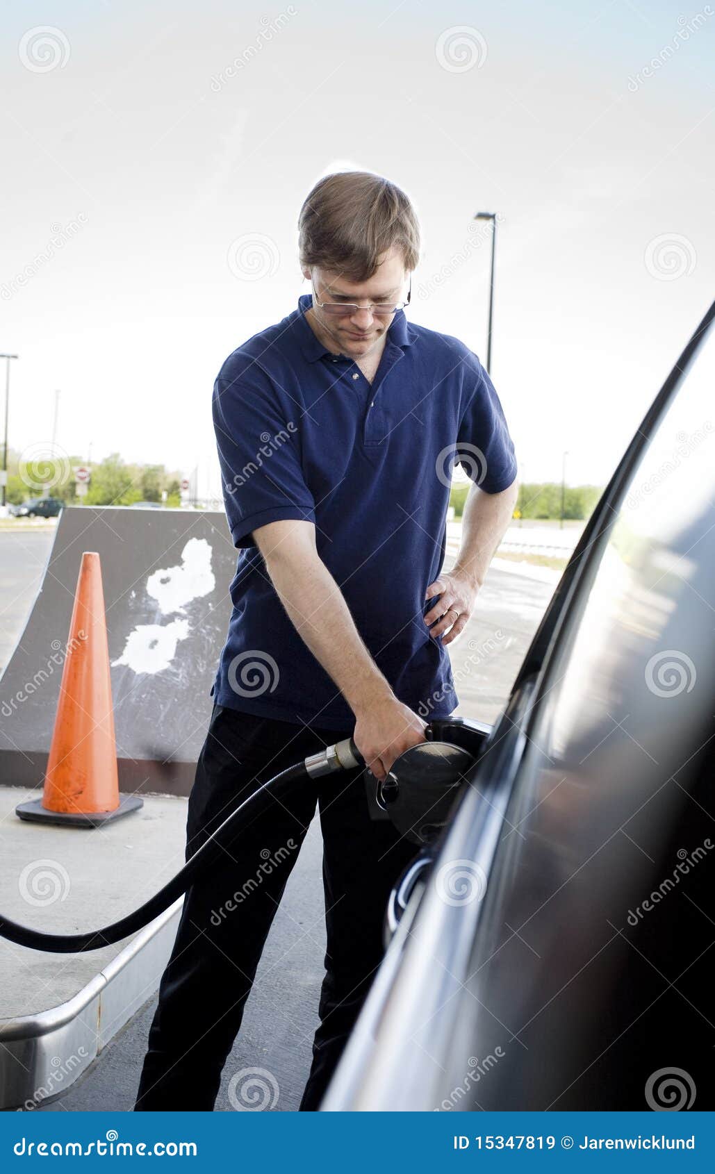 Man pumping gasoline stock image. Image of tank, smiling - 15347819