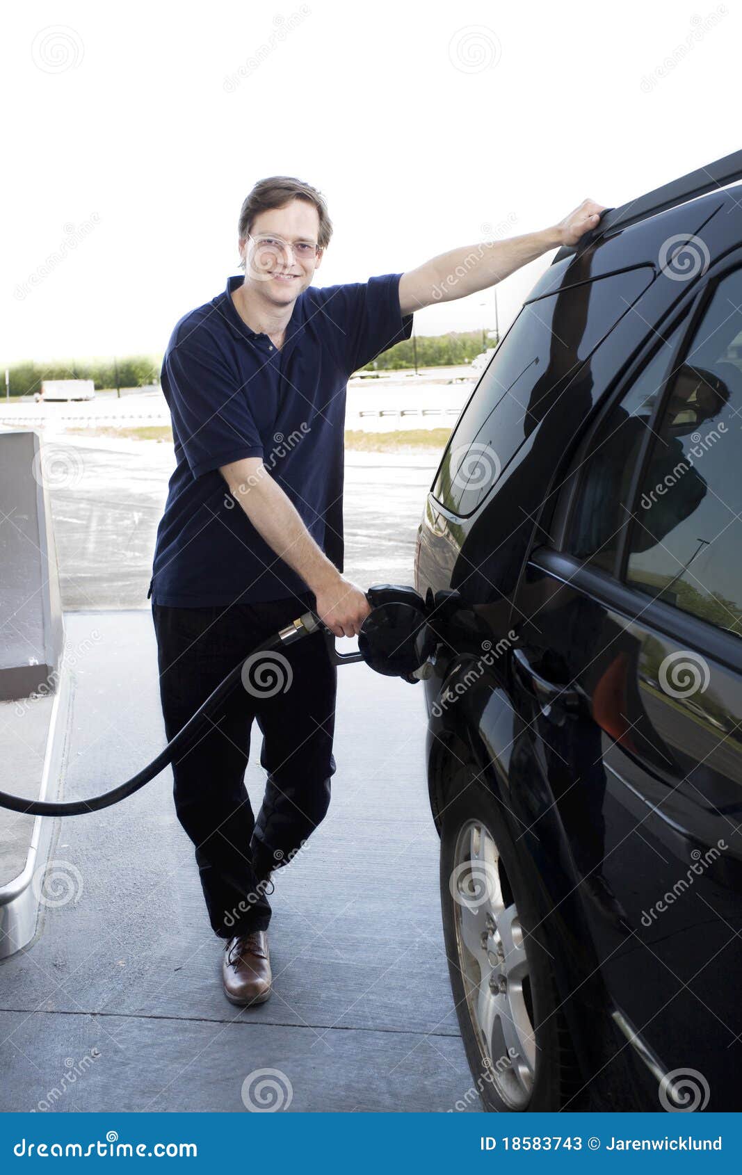 Man pumping gasoline stock image. Image of standing, smiling - 18583743