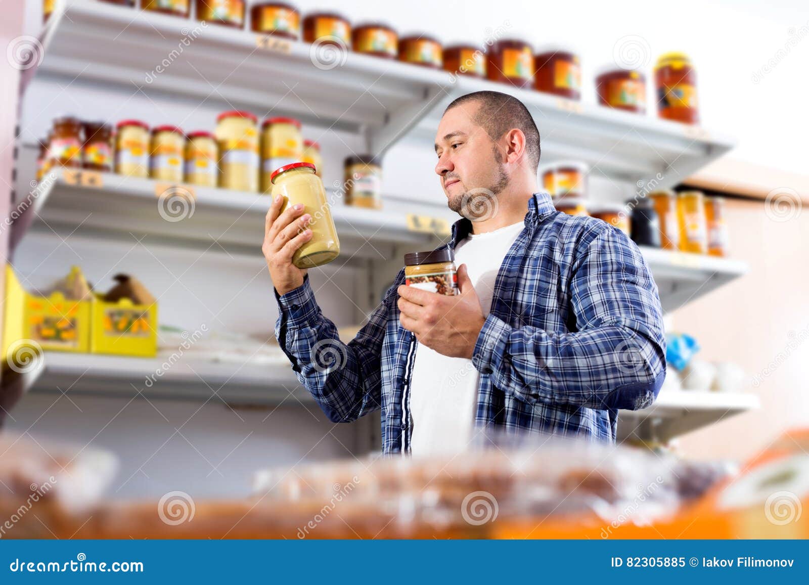 Man Purchasing Peanut Butter in Grocery Stock Image - Image of client ...