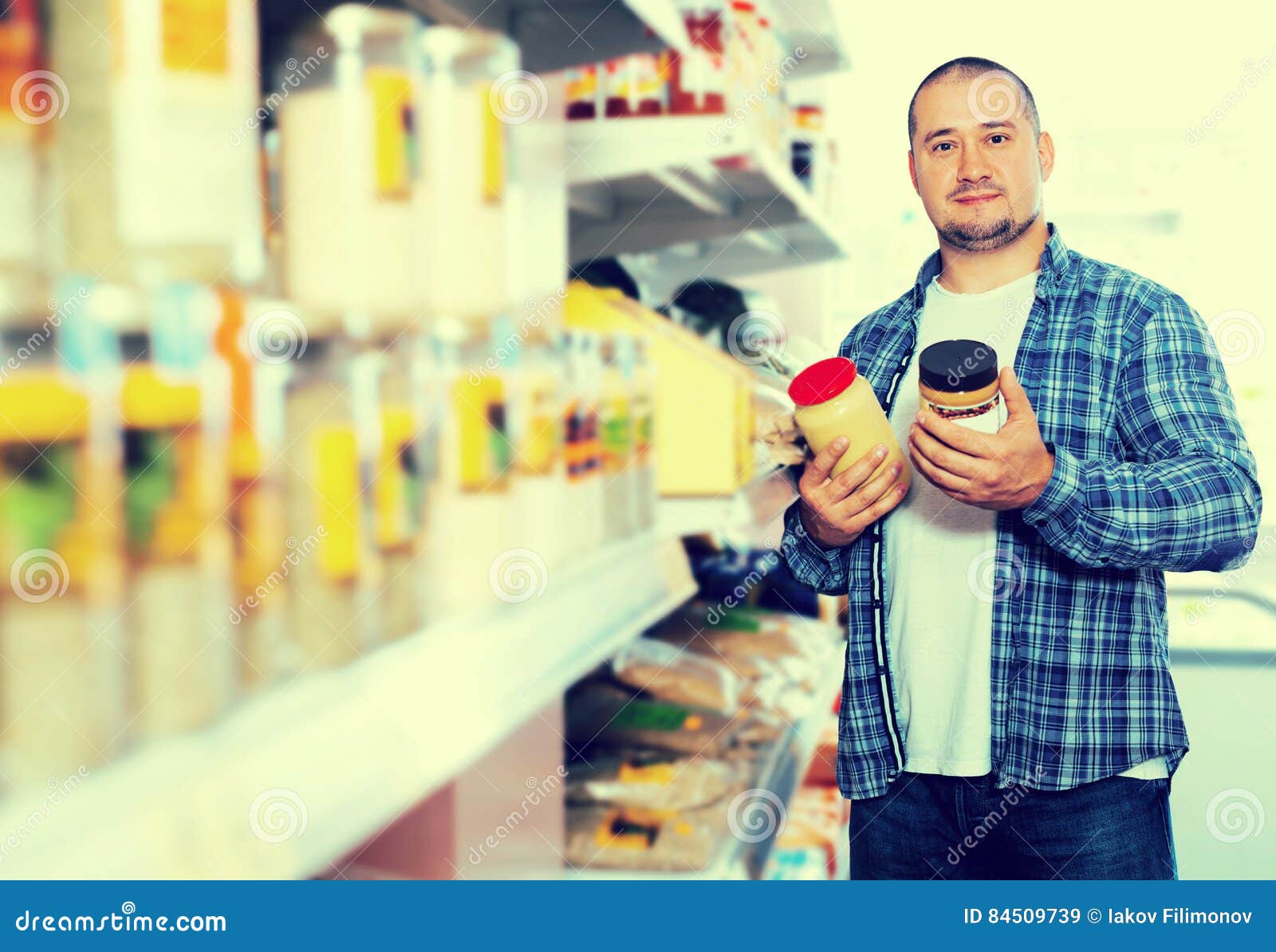 Man Purchasing Peanut Butter in Grocery Stock Image - Image of holding ...