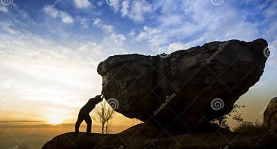 Man Pushing a Boulder on a Rock Stock Image - Image of metaphor ...