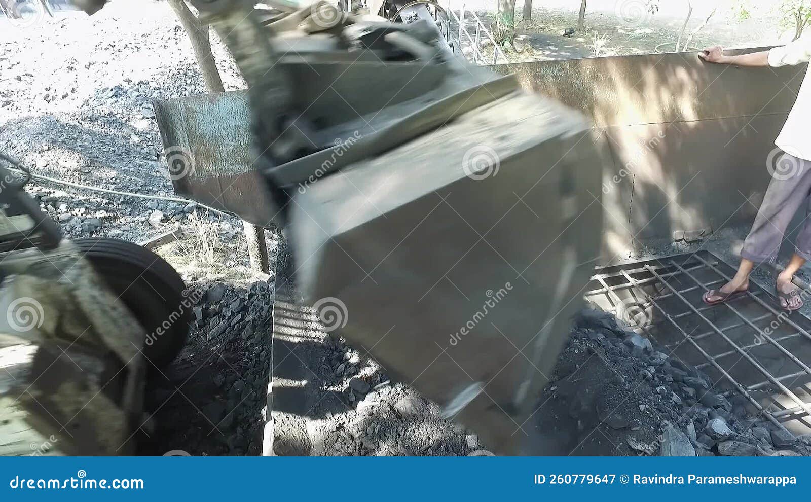Man Pushing Coal and Steer Loader Dumping Coal at Conveyor Machine ...