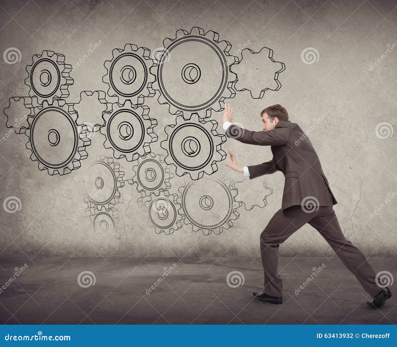 Man pushing cog wheel stock photo. Image of pushing, gear - 63413932