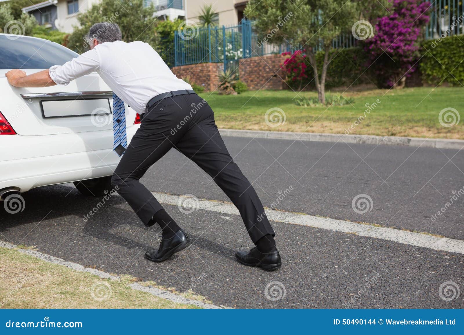 Man Pushing His Broken Down Car Stock Photo - Image of frowning, classy ...