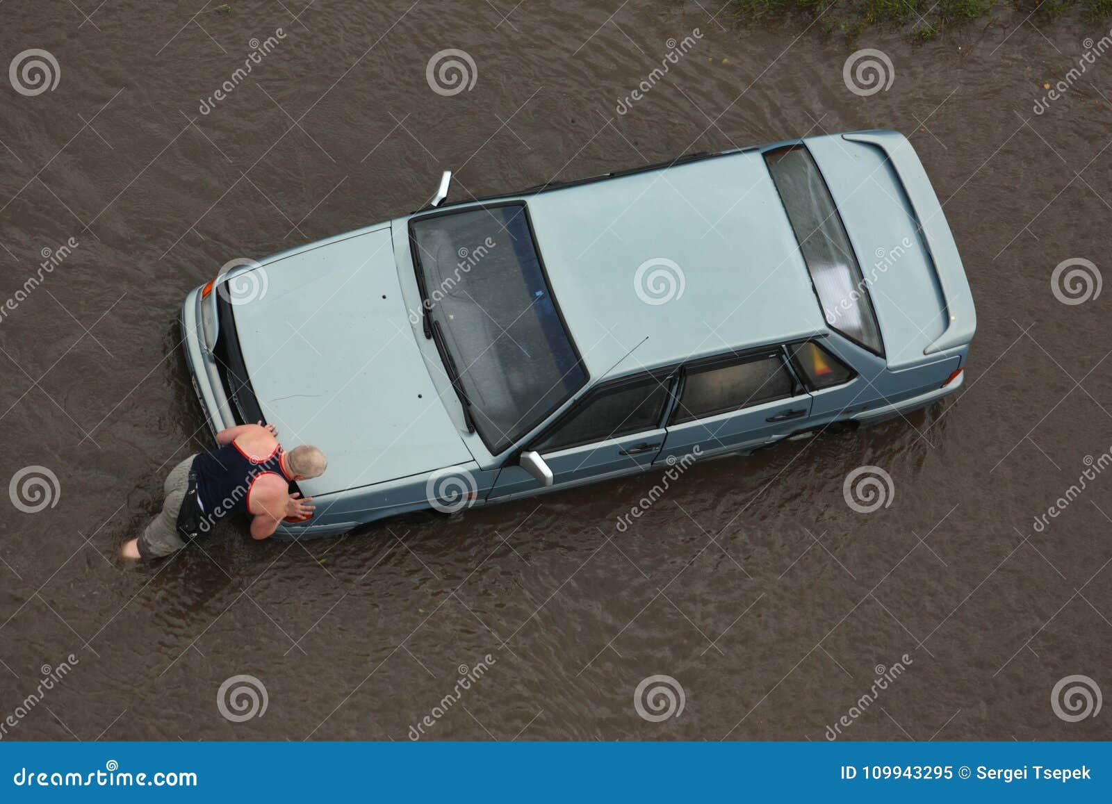 A Man Pushing His Car with Stalled Engine in Water Editorial Image ... A Man Pushing His Car with Stalled Engine in Water Editorial Image ...