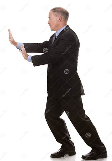 Man pushing an object stock photo. Image of portrait - 26957166