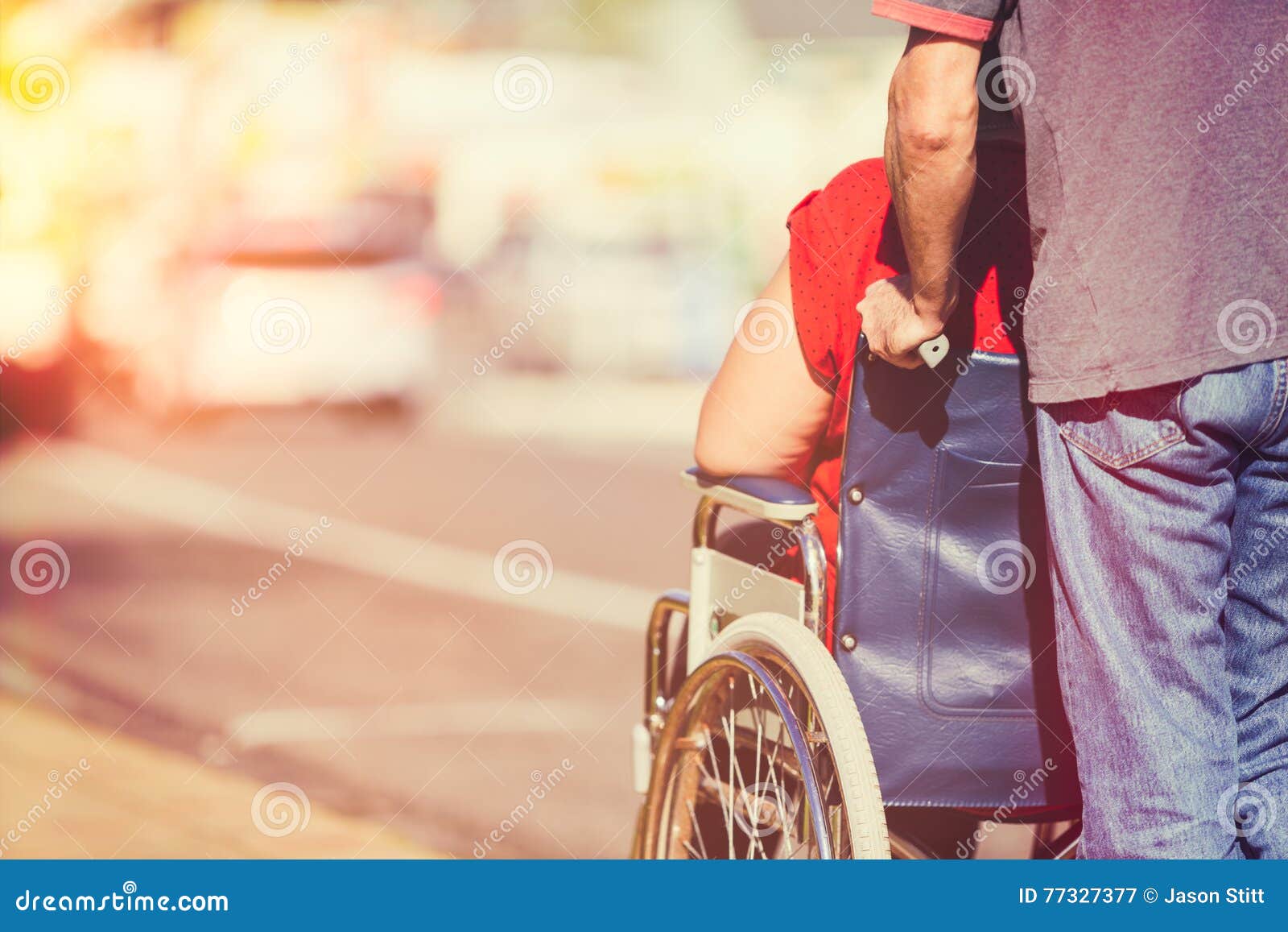 Man Pushing Wheelchair stock image. Image of handicap - 77327377