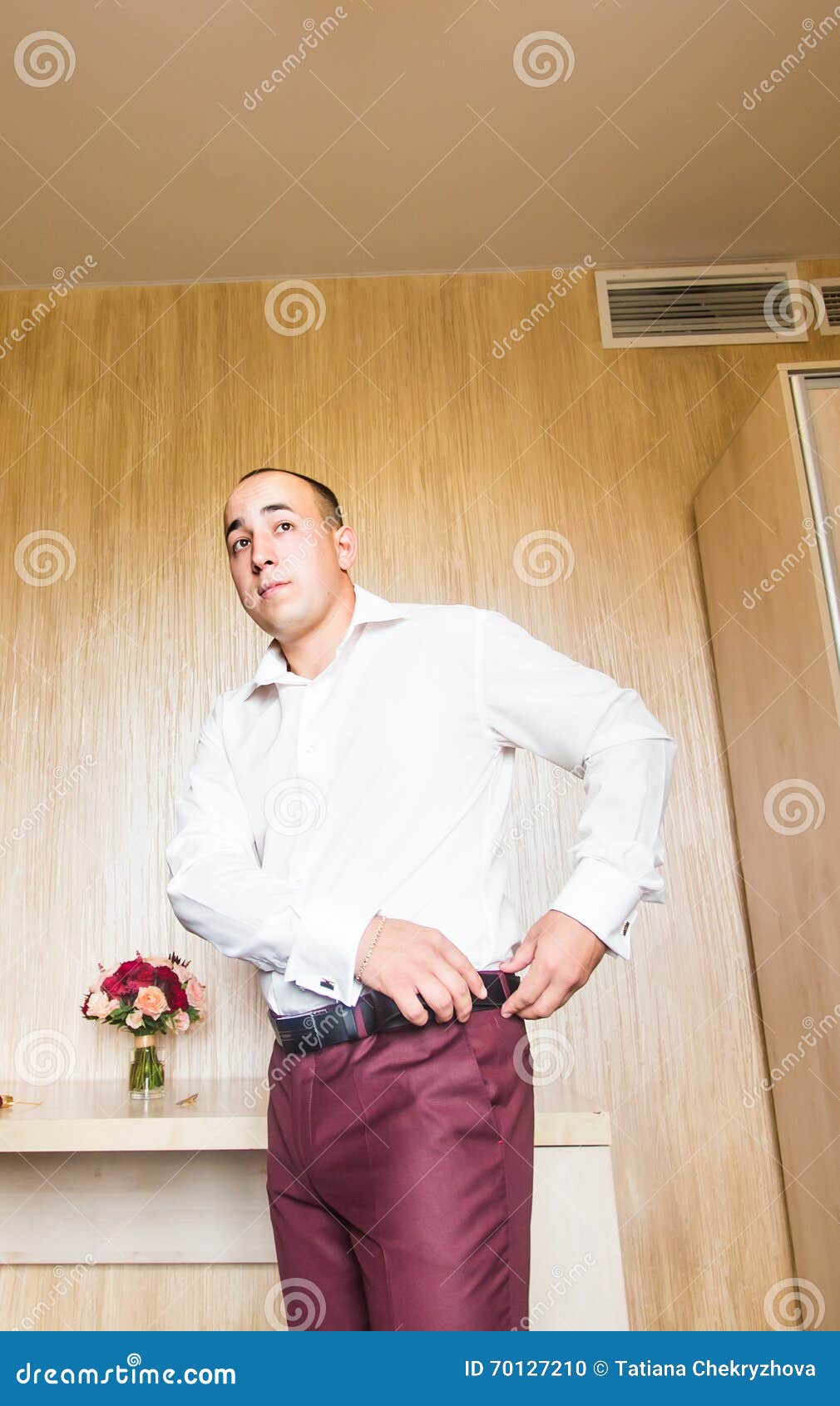 Man puts on belt stock photo. Image of groom, celebration - 70127210