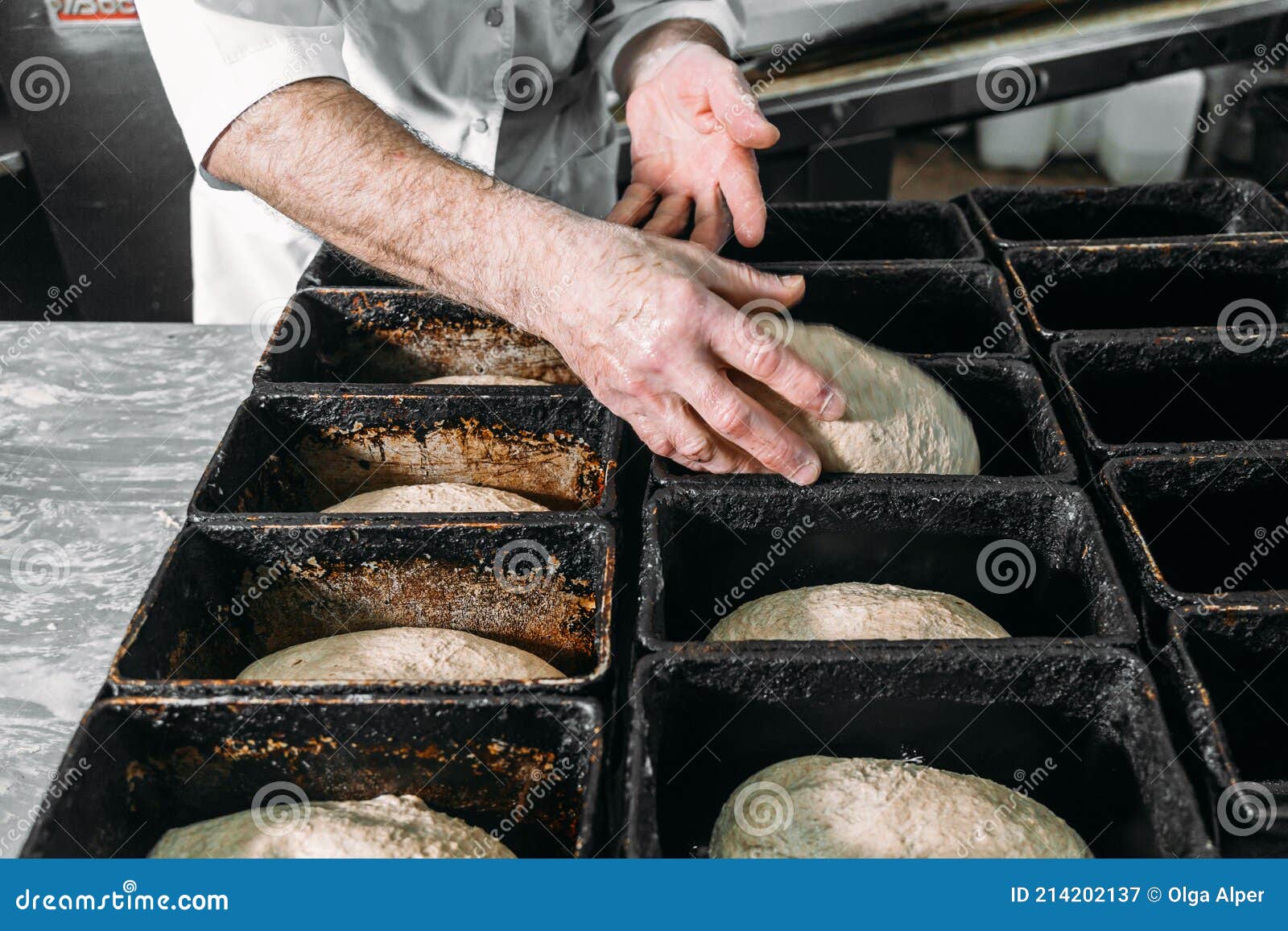 A Man Puts Dough in a Bread Pan. Bread Making Process Stock Image ...