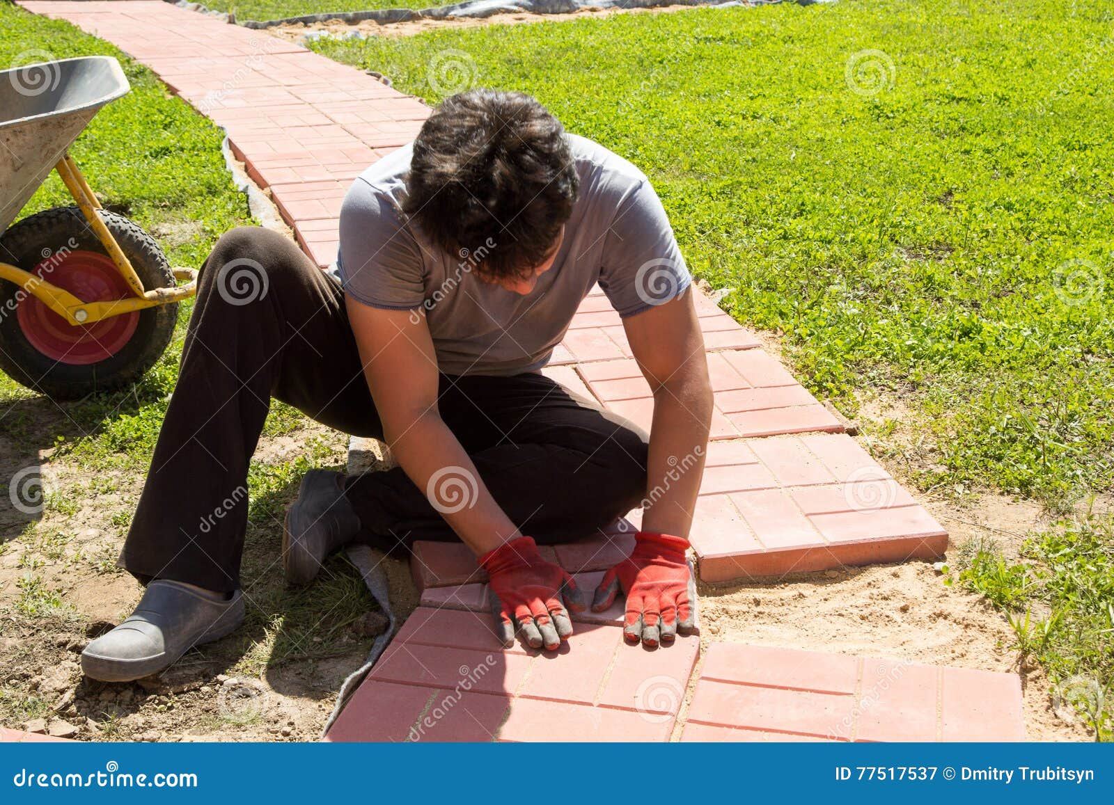 Man Puts Red Concrete Paving Slabs Stock Image - Image of background ...
