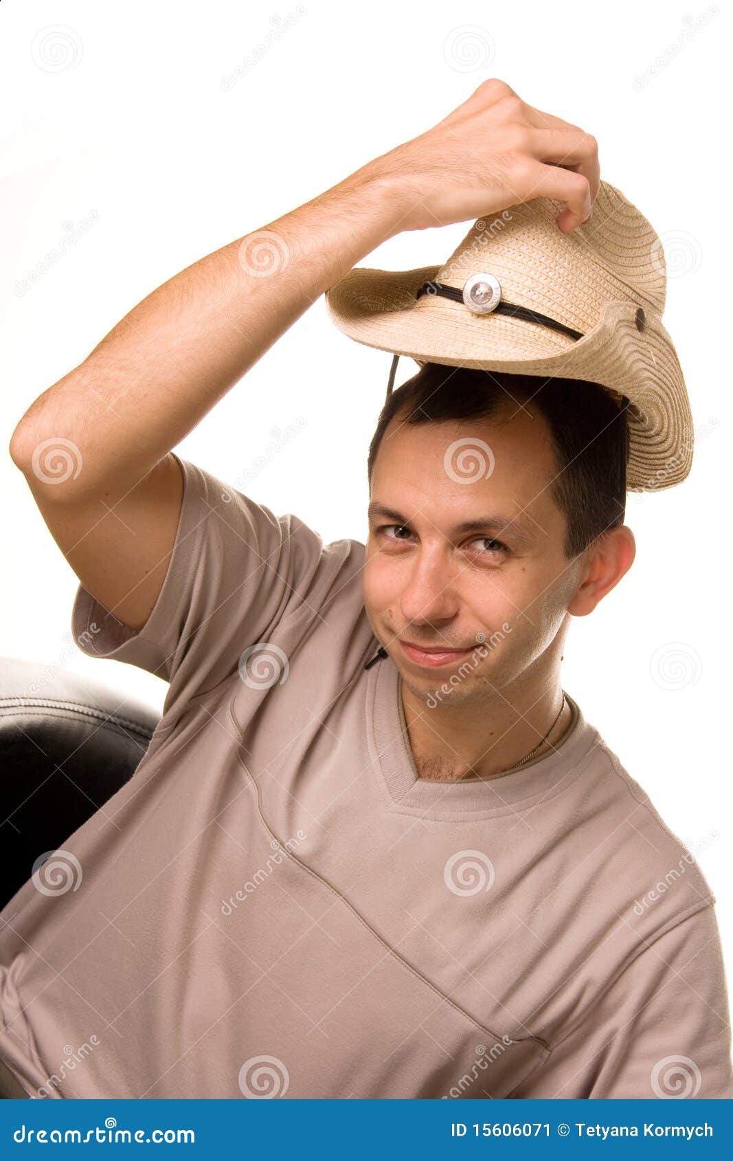 The Man Puts On A Straw Hat A Head Stock Image - Image: 15606071
