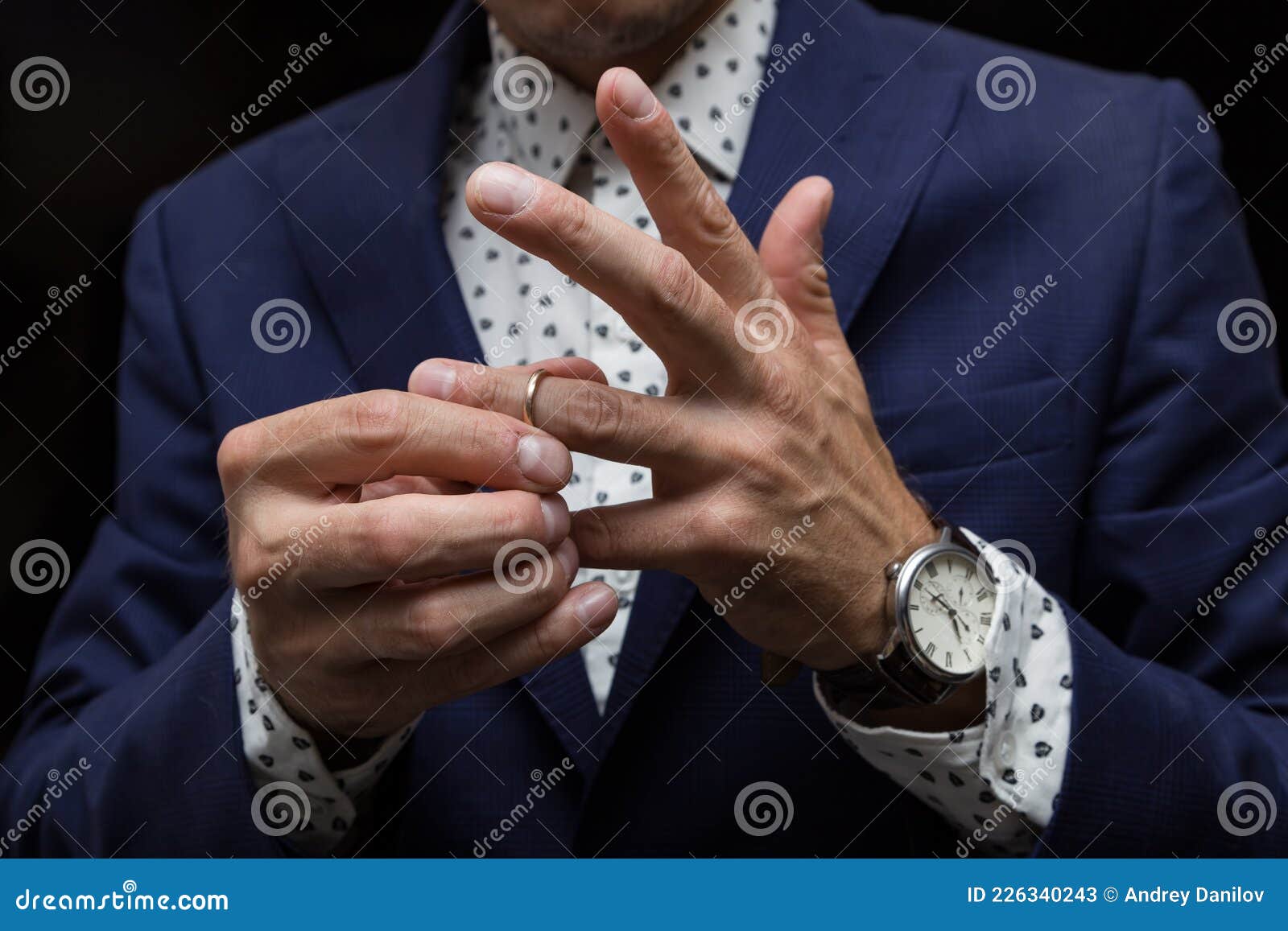 A Man Puts a Wedding Ring on His Finger, the Concept of Cheating on a ...