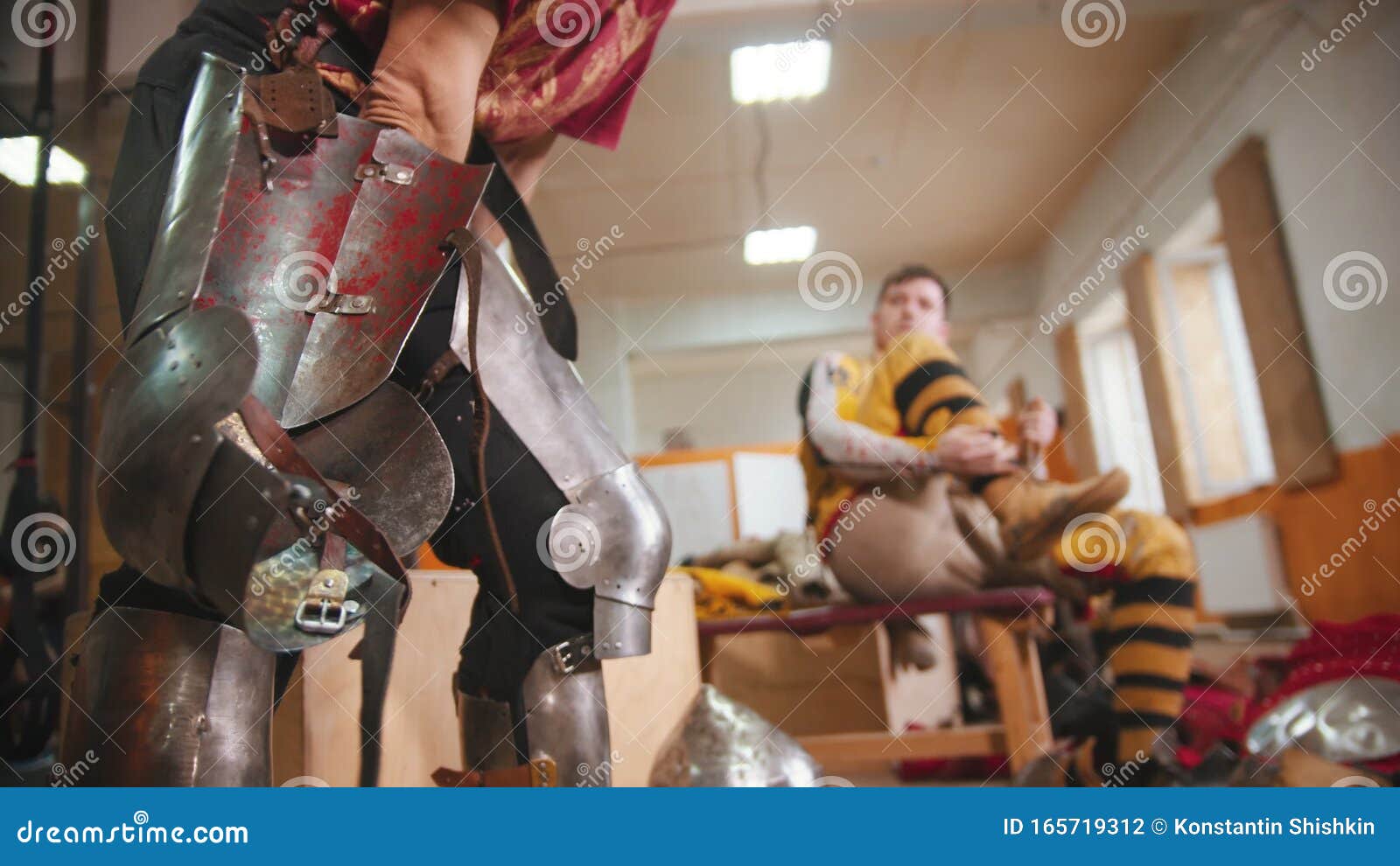 A Man Putting on an Armour for the Knights Battle Training Stock ...