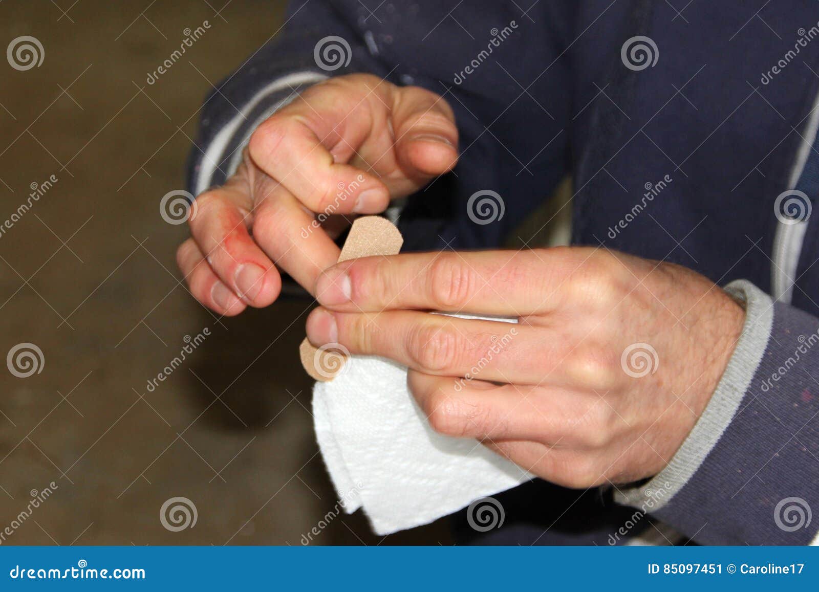 Man Putting Band-aid Around His Bleeding Finger Stock Image - Image of ...