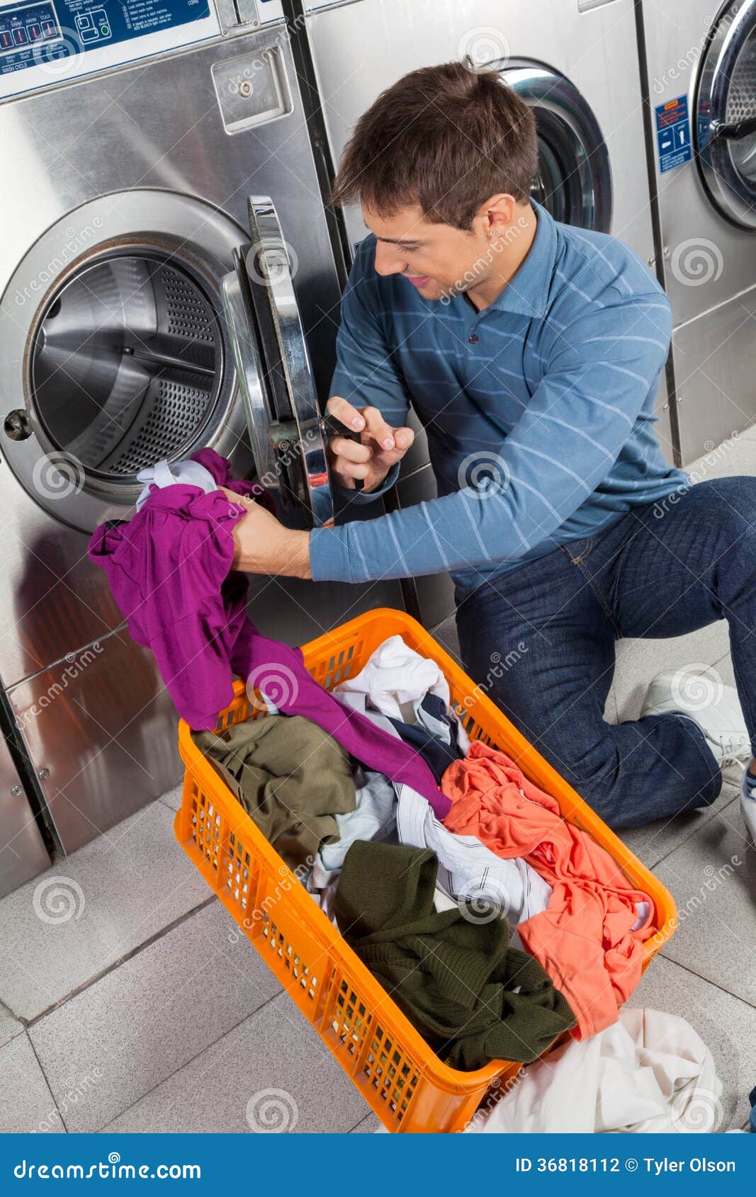 Man Putting Clothes in Washing Machine Stock Photo - Image of coin ...