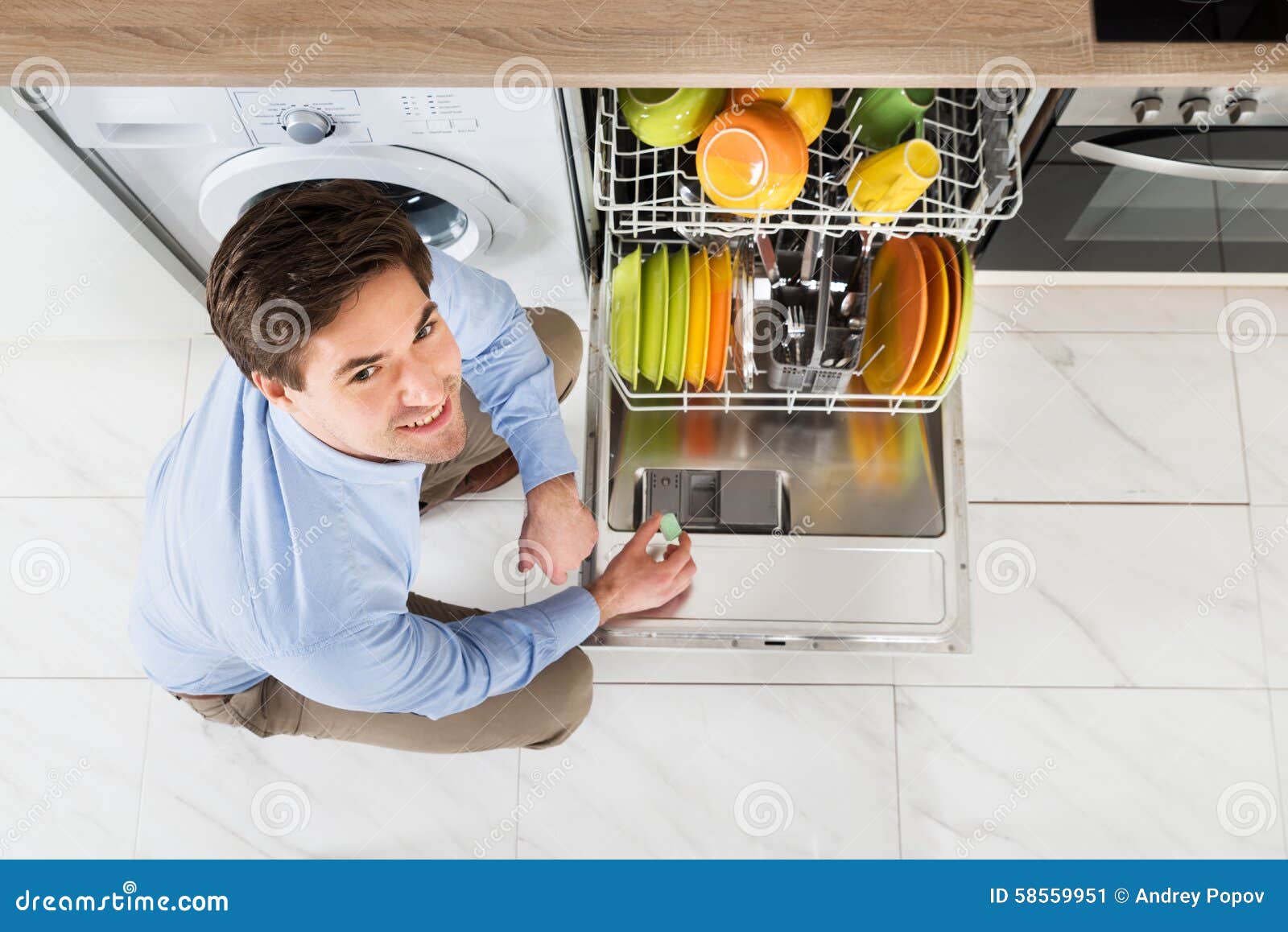 Man Putting Dishwasher Soap Tablet in Dishwasher Stock Image - Image of ...