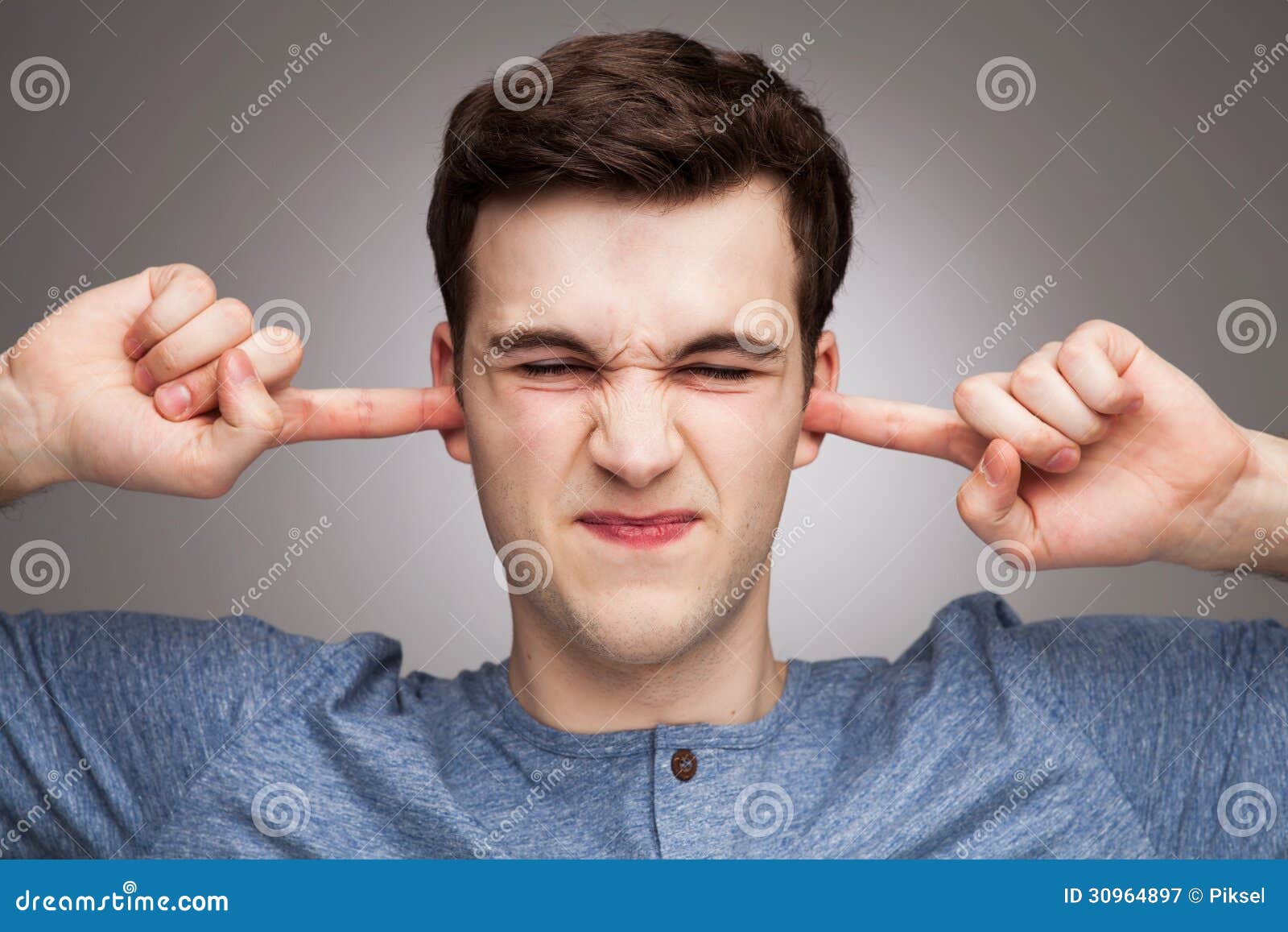 Man Putting Fingers in Ears Stock Image - Image of young, people: 30964897