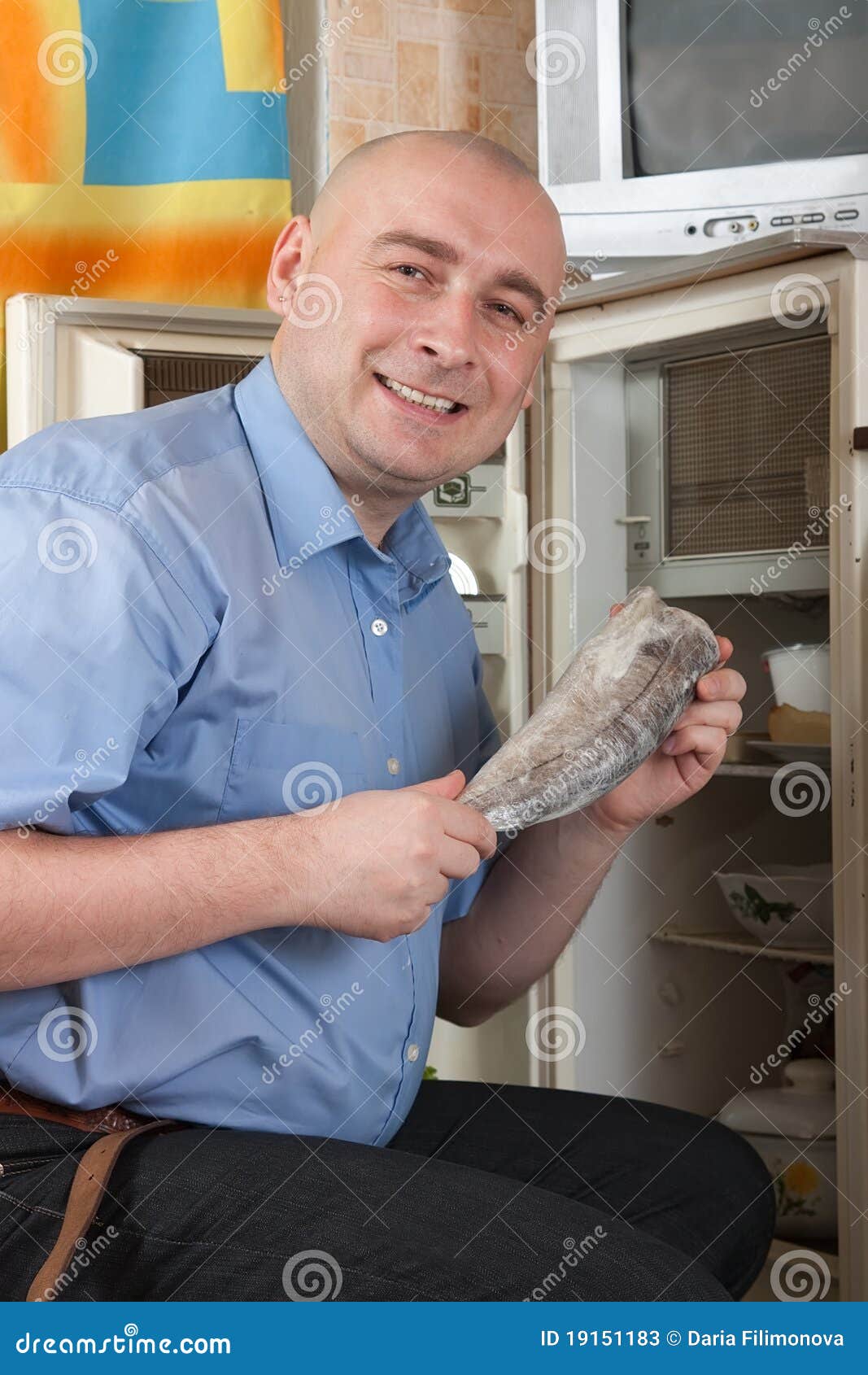 Man Putting Fish into Refrigerator Stock Image - Image of diet, female ...