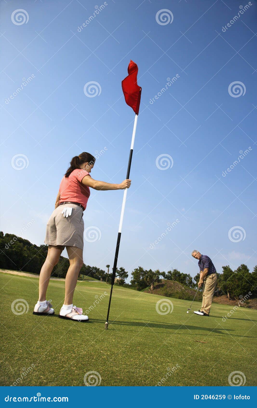 Man putting at golf course stock image. Image of game - 2046259