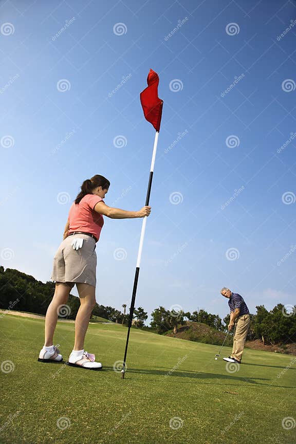 Man putting at golf course stock image. Image of game - 2046259