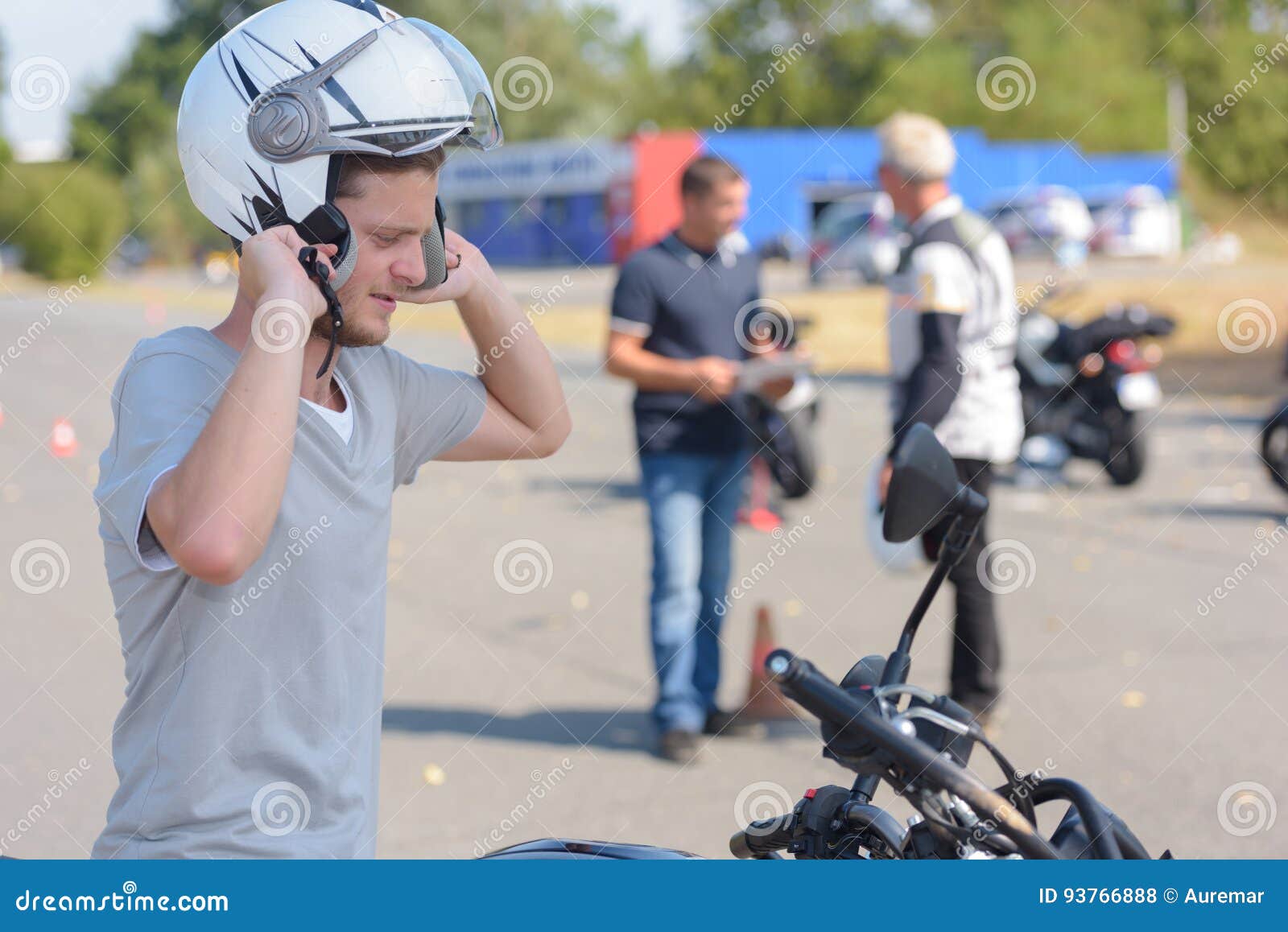 Man Putting Helmet on Student Stock Photo - Image of safe, rider: 93766888