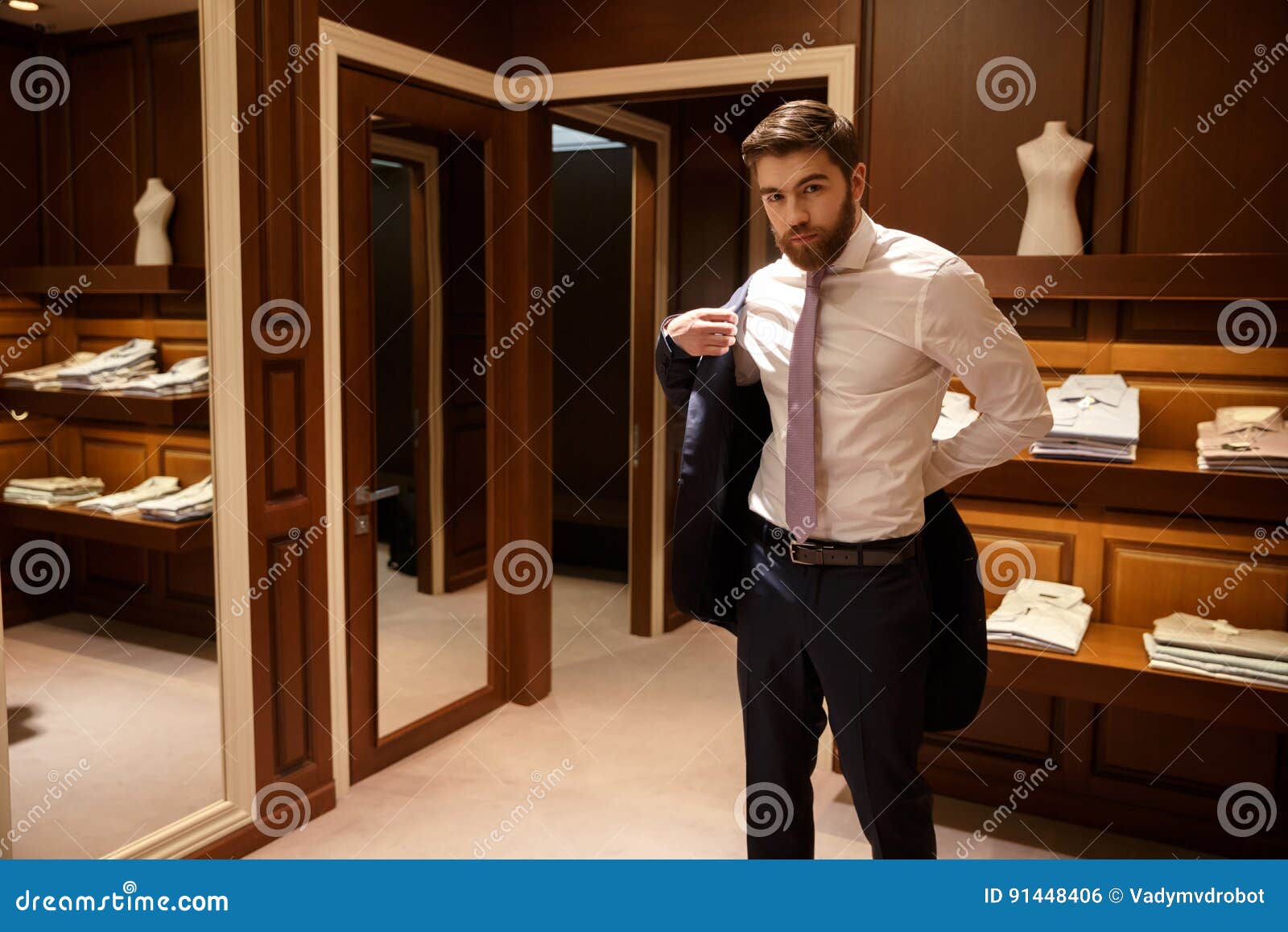 Man putting on his jacket stock photo. Image of menswear - 91448406