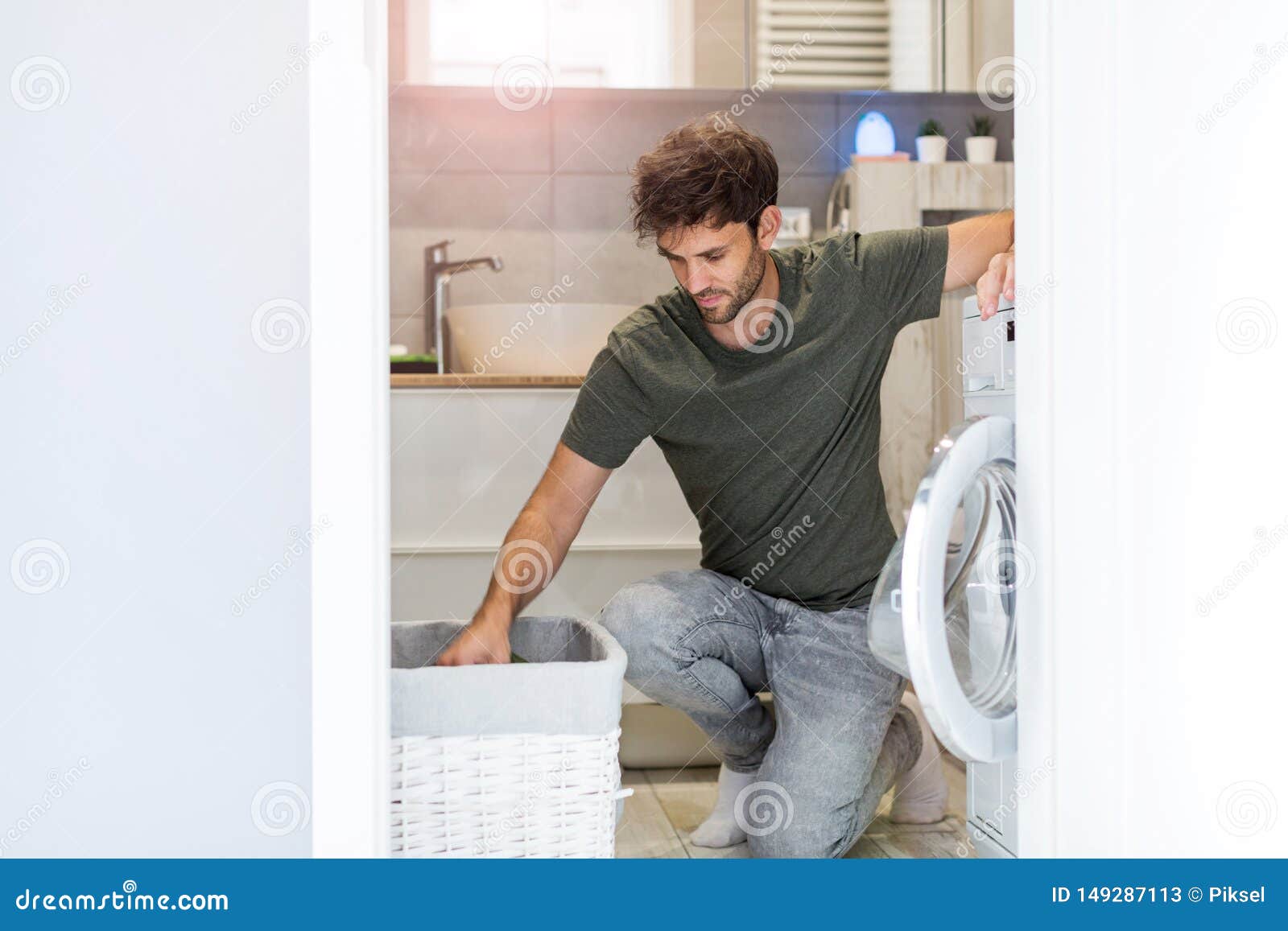 Man Loading Washing Machine Stock Image - Image of house, putting ...