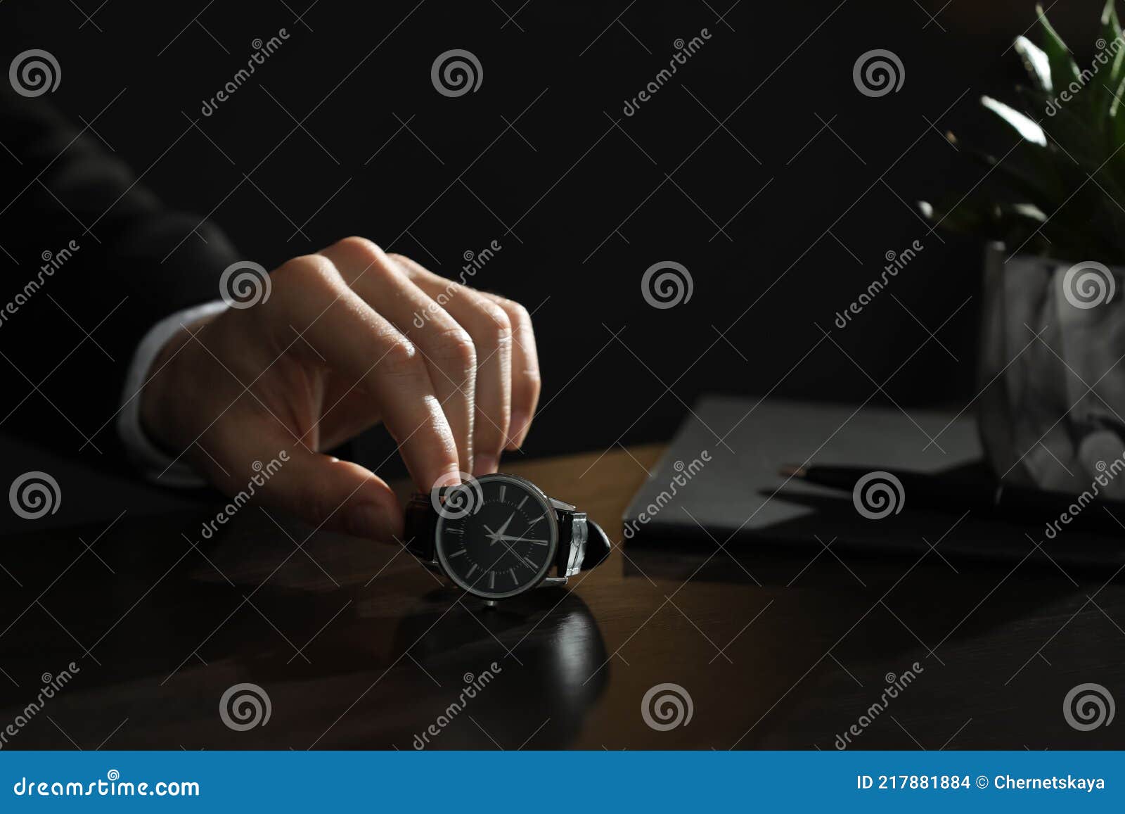 Man Putting Luxury Wrist Watch on Table, Closeup. Space for Text Stock ...