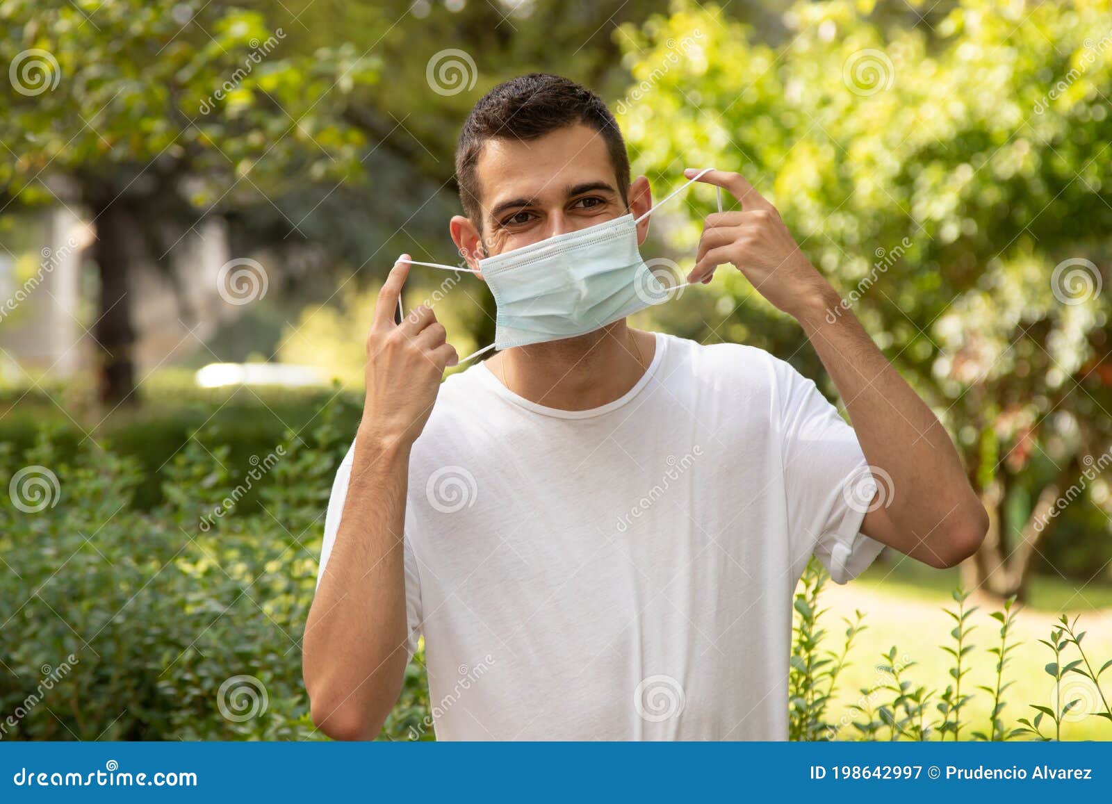 Man Putting on Mask Outdoors Stock Image - Image of life, person: 198642997