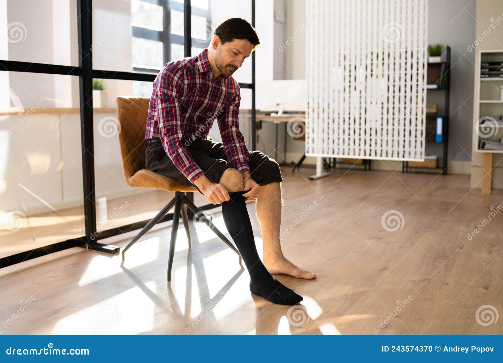 Man Putting on Medical Compression Stockings Stock Photo - Image of ...