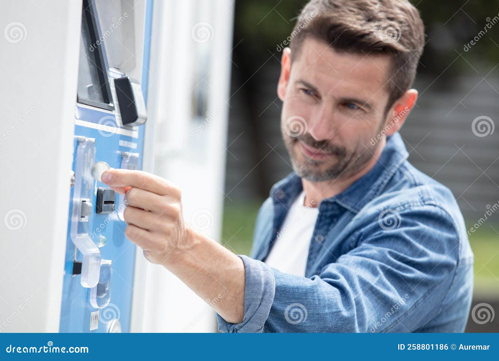 Man Putting Money in Pressure Tyre Machine Stock Photo - Image of ...