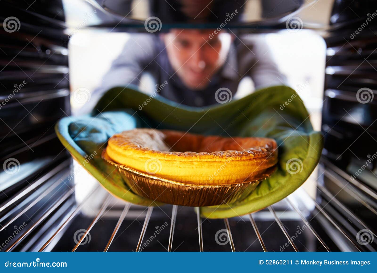 Man Putting Savoury Pie into Oven To Bake Stock Image - Image of oven ...