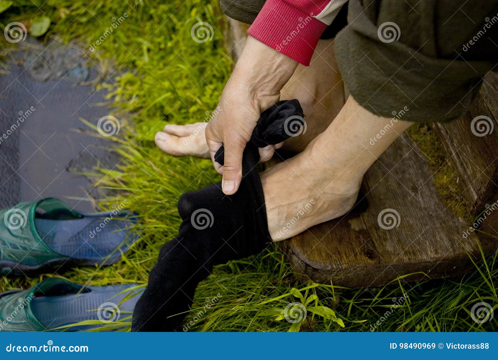 Man Putting Socks stock image. Image of clothing, sandals - 98490969