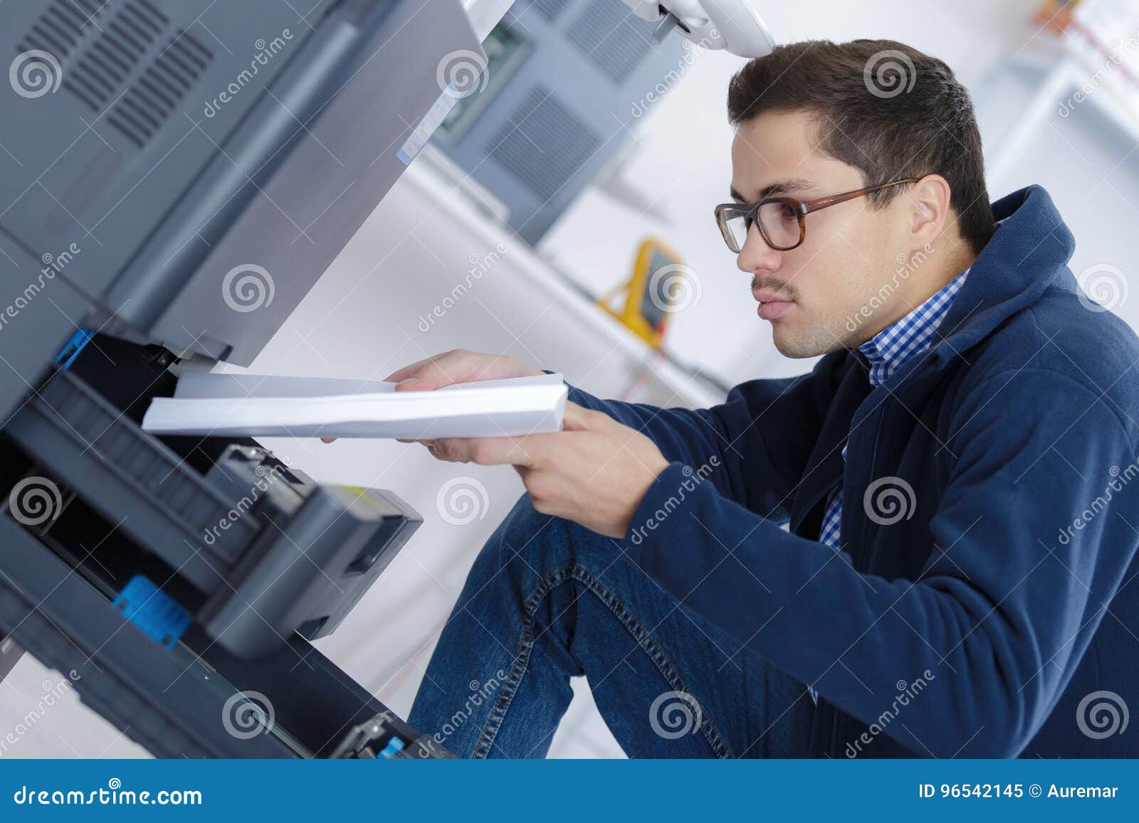 Man Putting Stack Paper in Printing Machine Stock Image - Image of ...