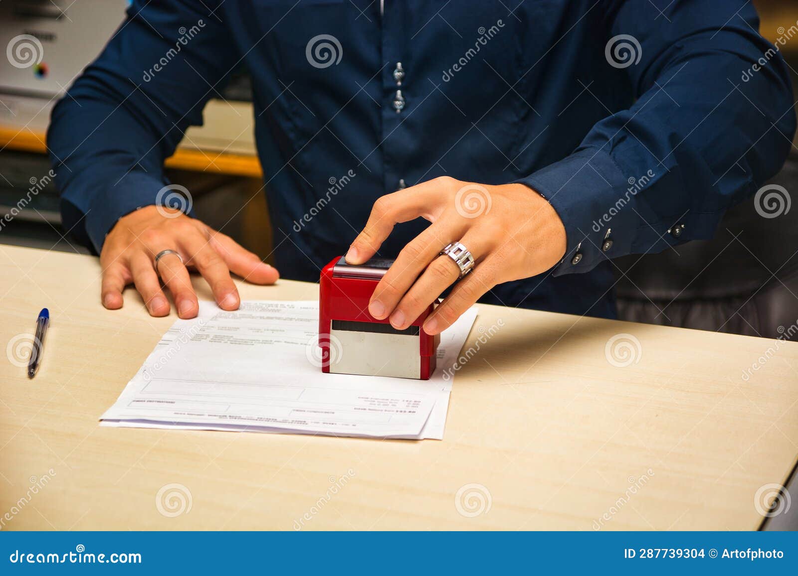 Photo of a Man Stamping a Document Stock Photo - Image of contract ...