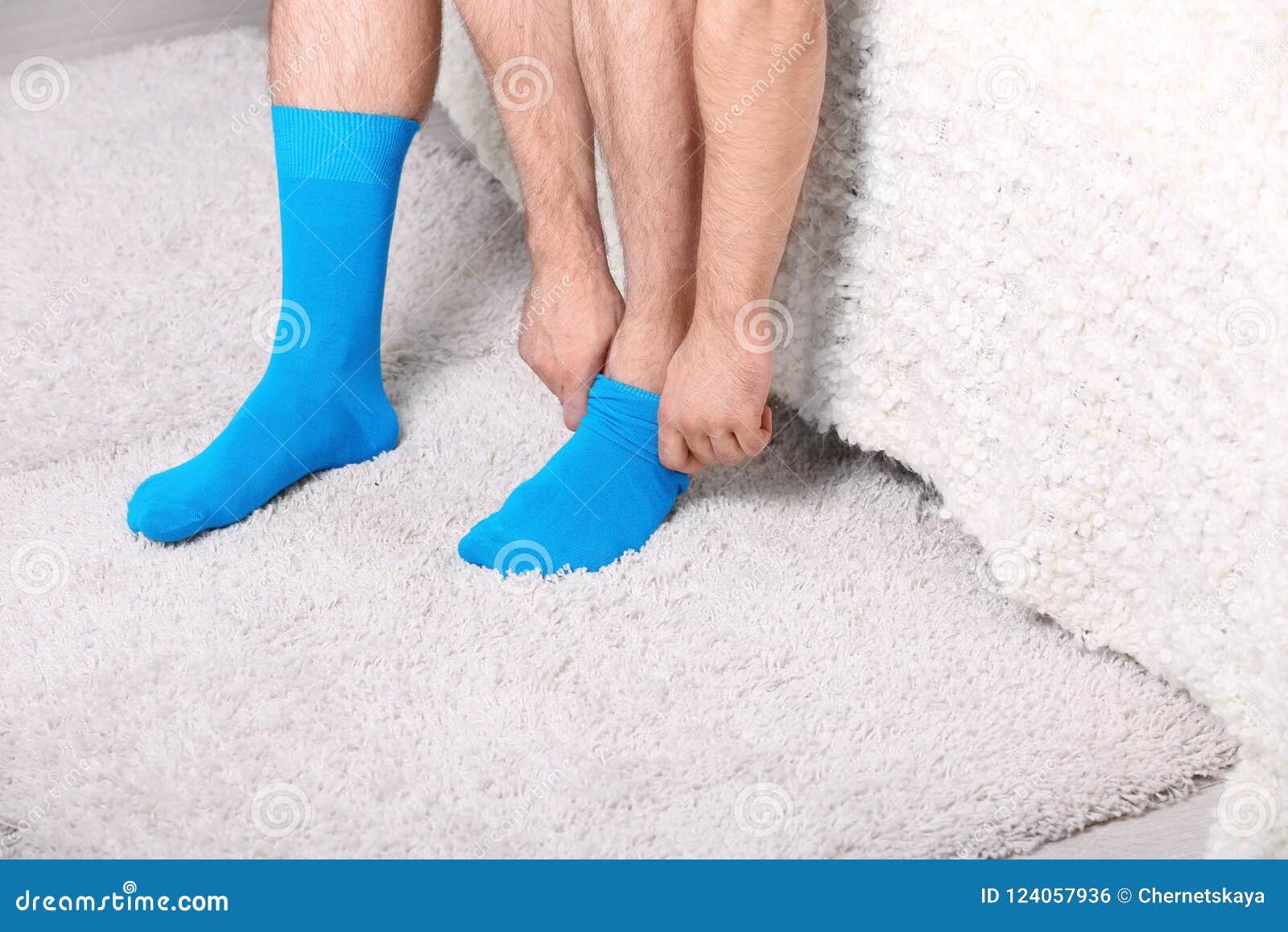 Man Putting on Stylish Socks in Bedroom Stock Photo - Image of garment ...