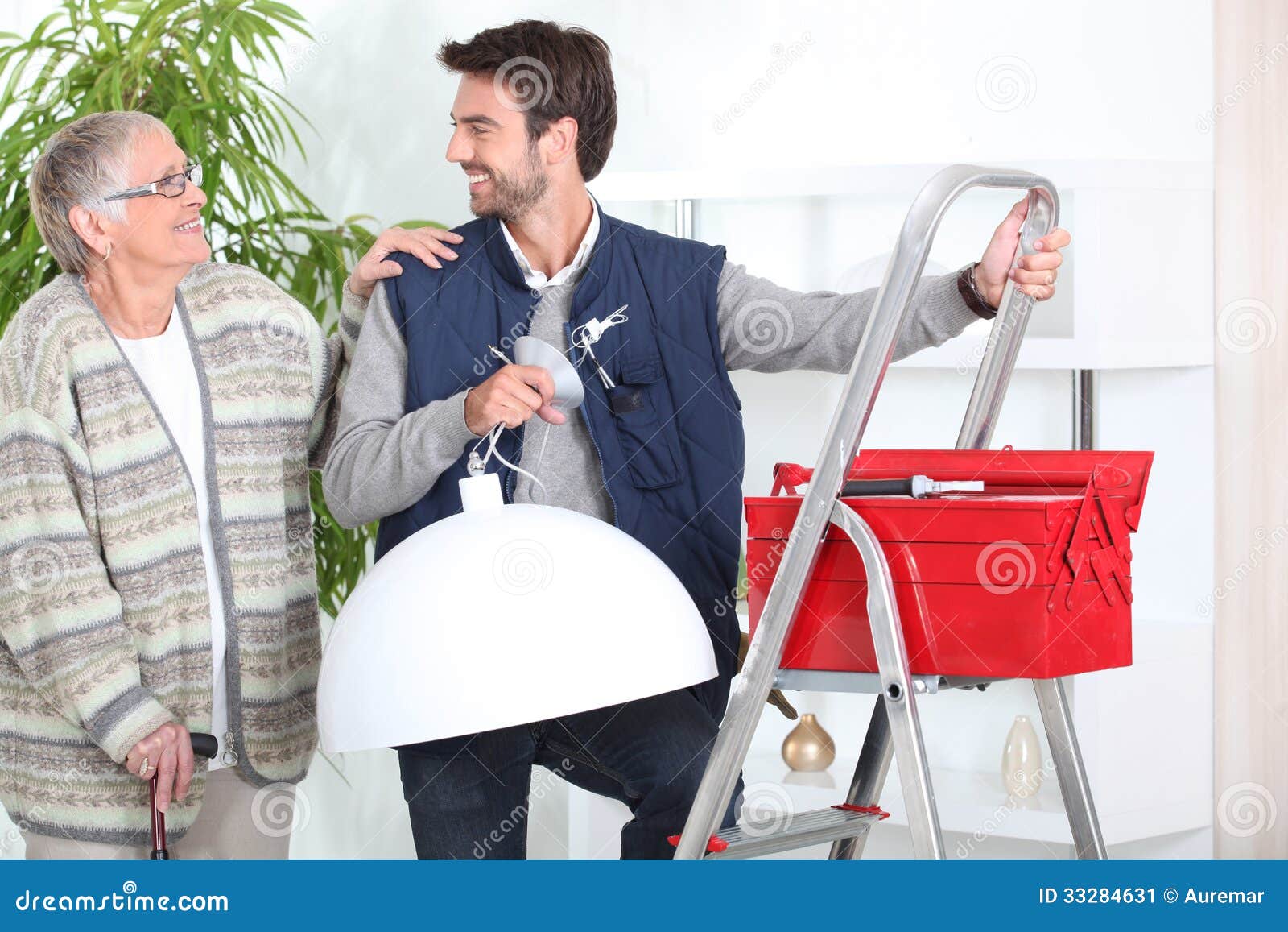 Man putting up a light stock image. Image of fitting - 33284631