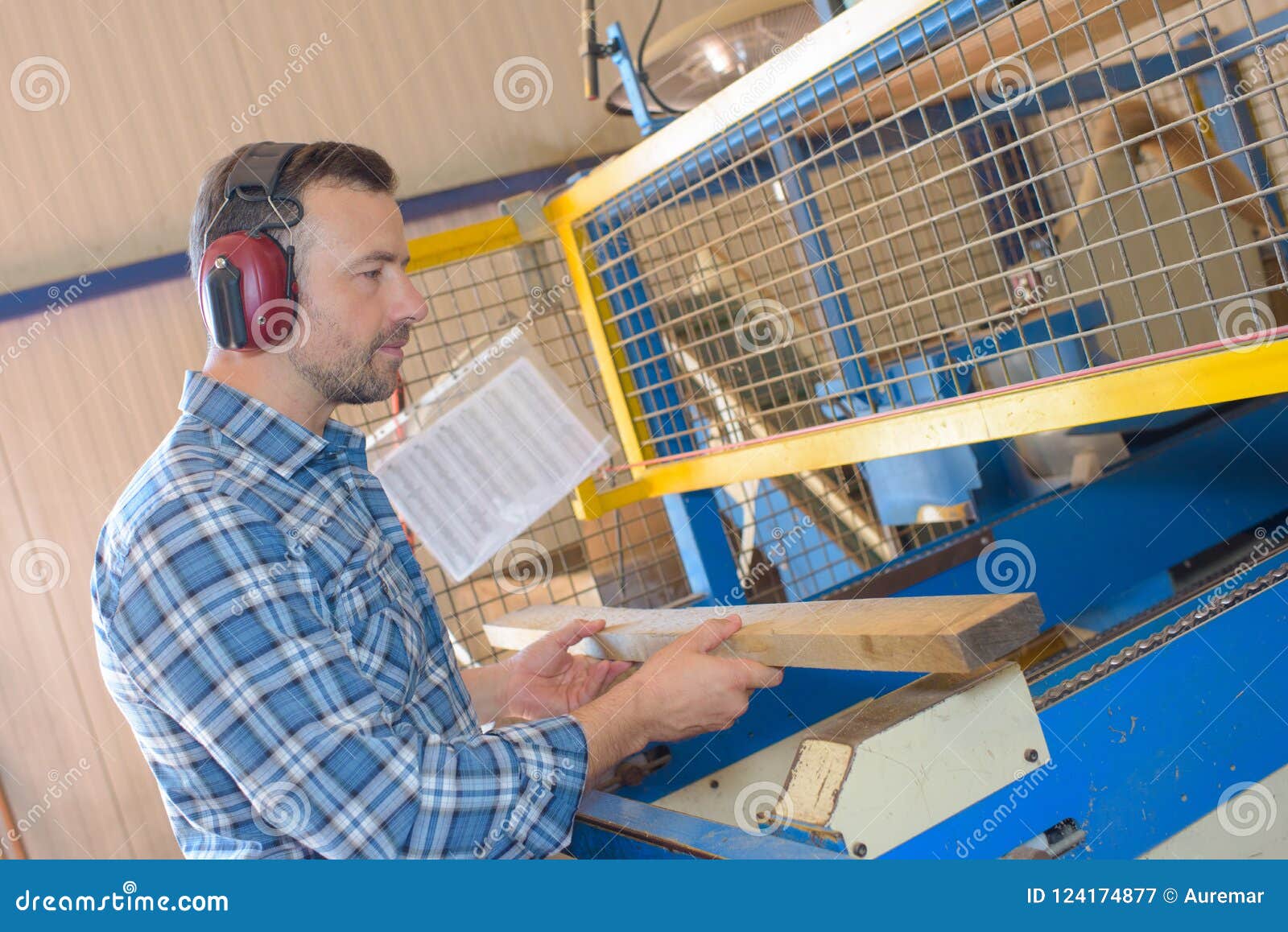 Man Putting Wood into Machine Stock Image - Image of standing, manual ...